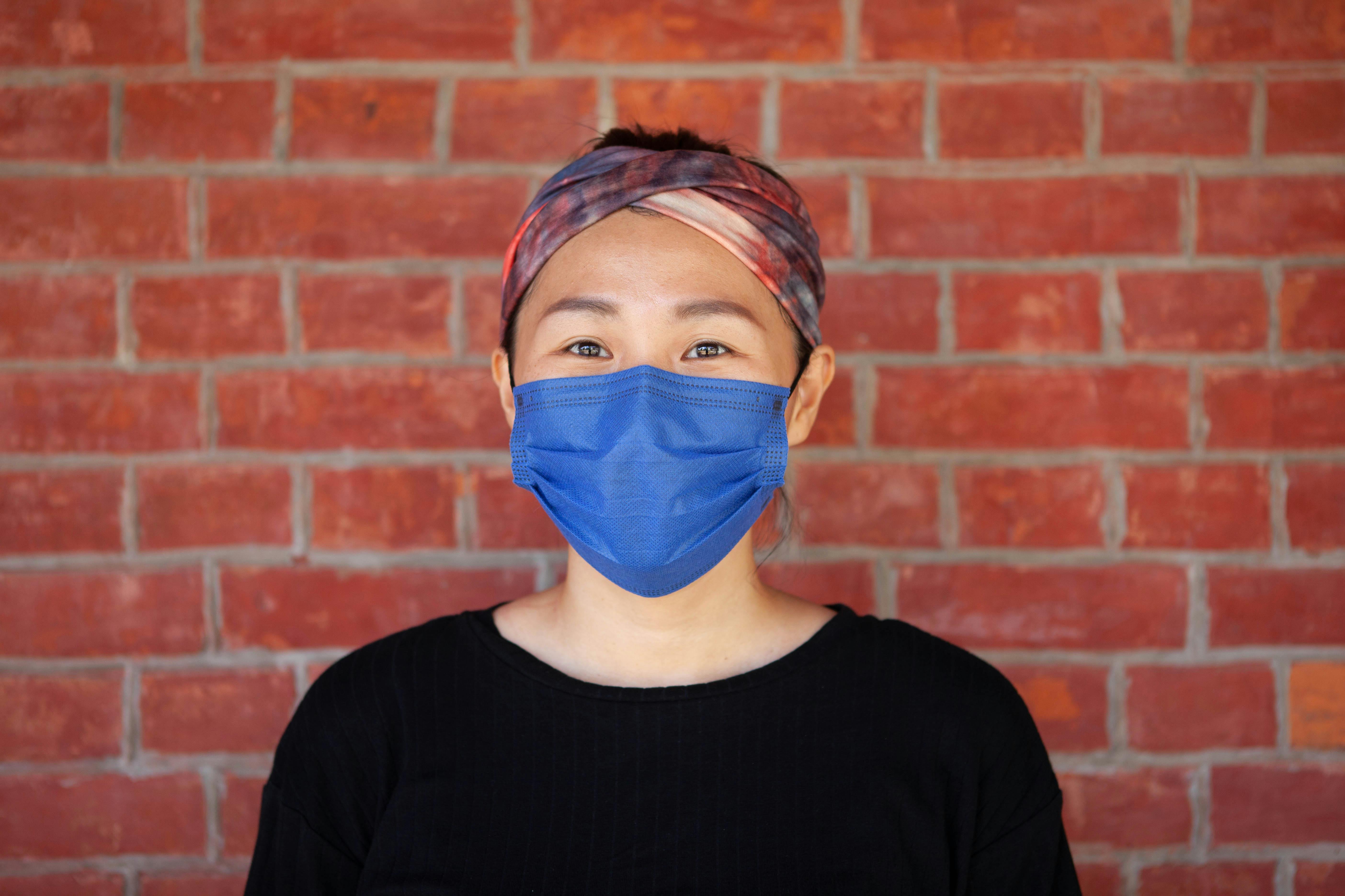 Close-Up Shot of a Woman in Black Top Wearing a Face Mask · Free Stock ...