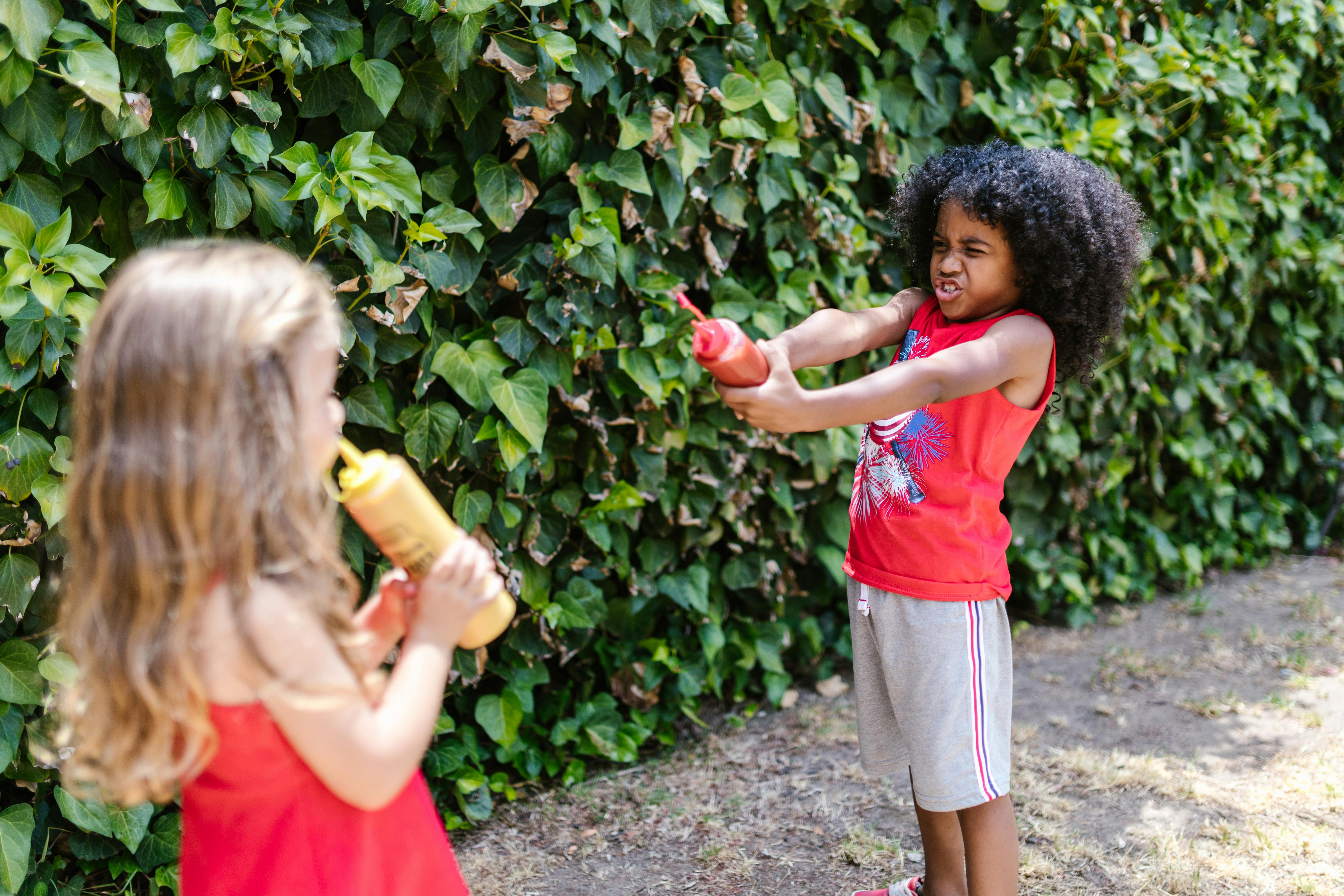 A Children Playing Ketchup · Free Stock Photo