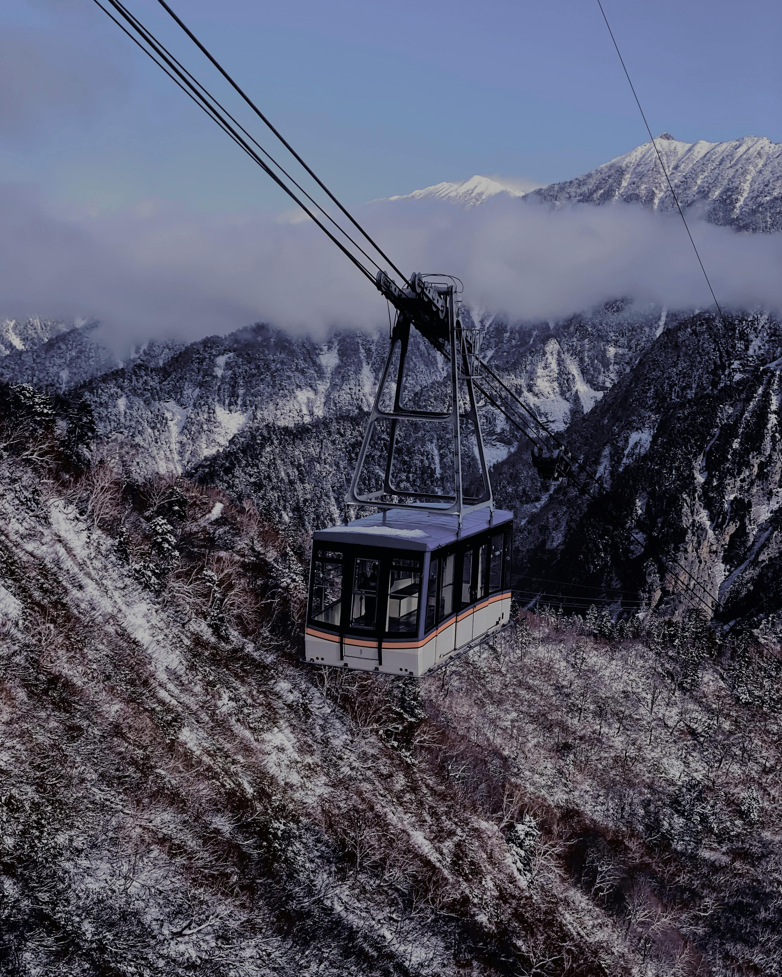 A White and Black Cable Car · Free Stock Photo
