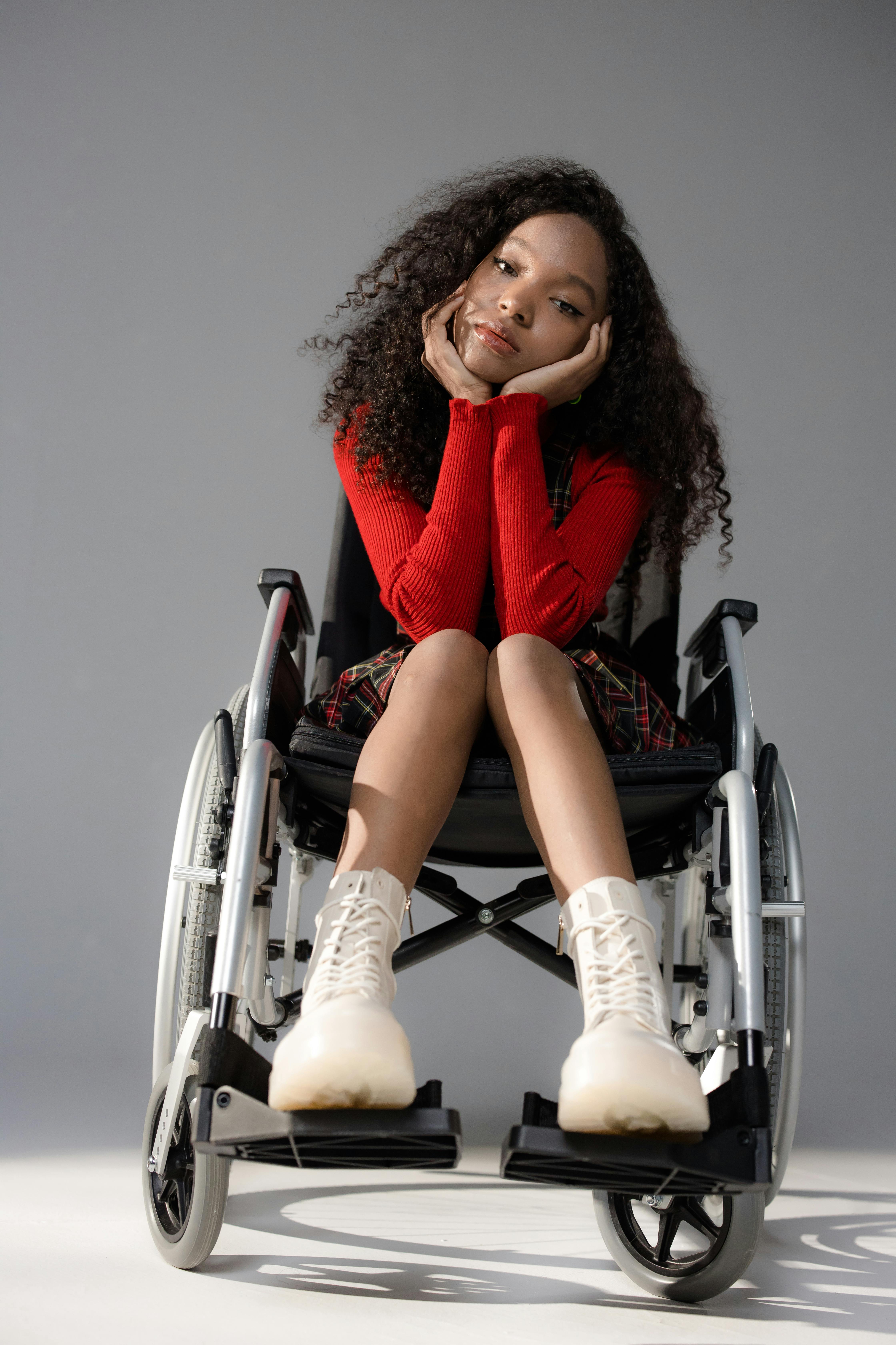 A Girl on a Wheelchair Posing · Free Stock Photo