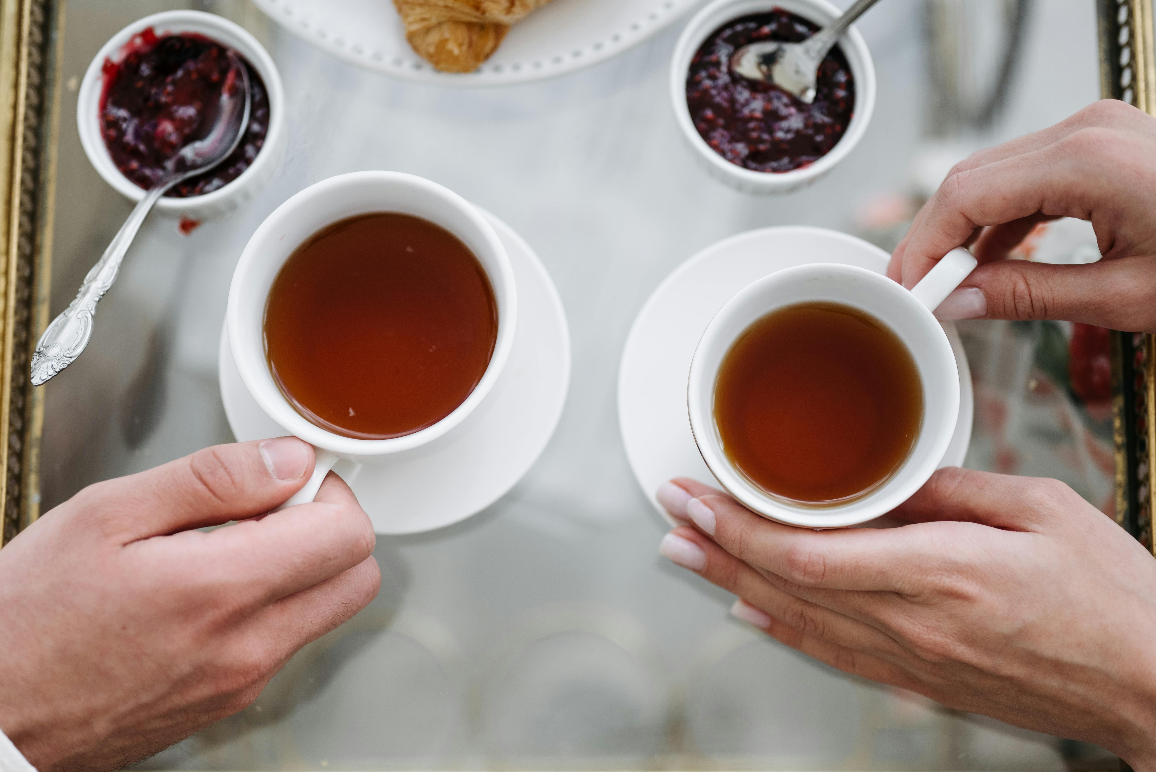 People Holding Cups with Tea · Free Stock Photo