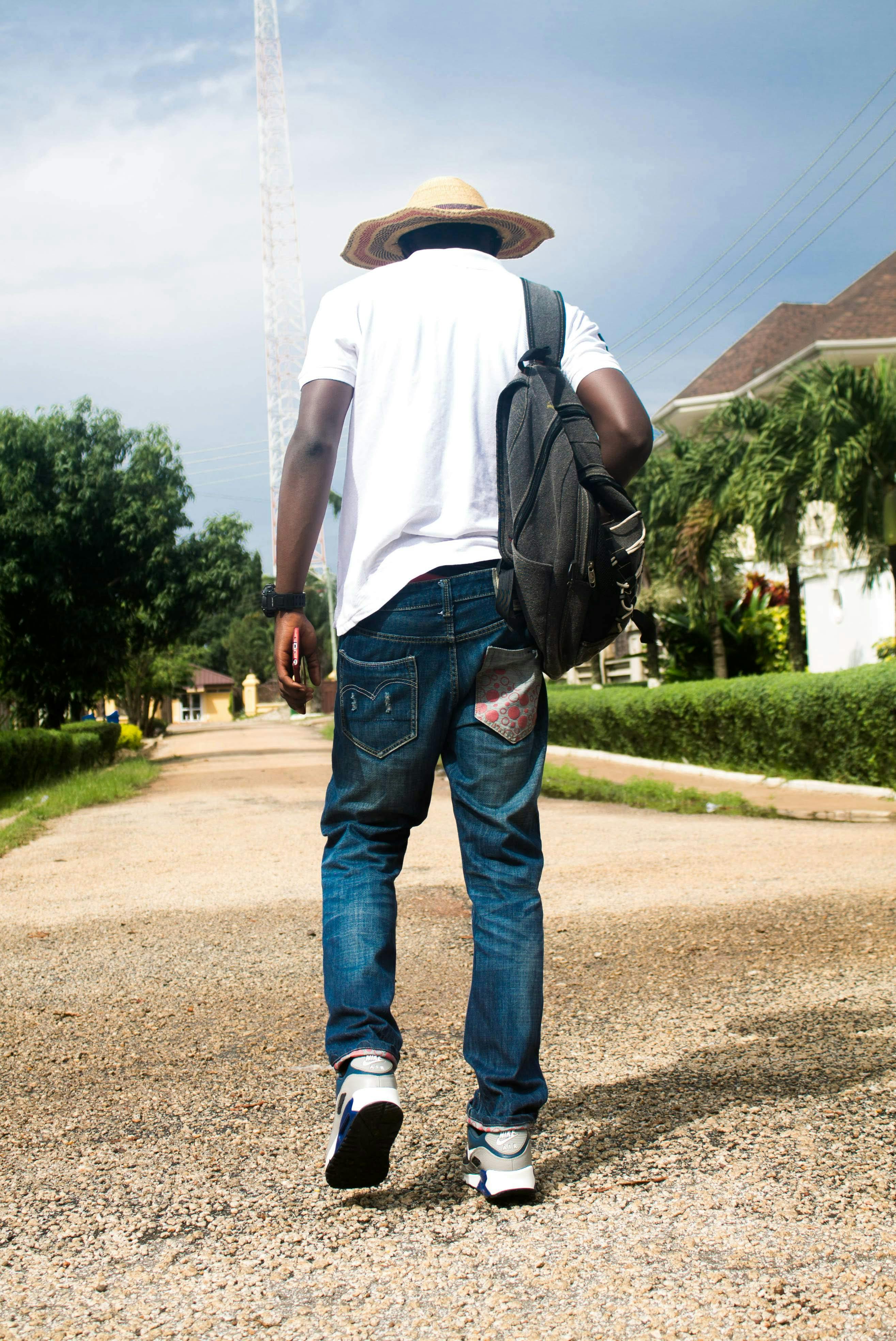 Man Carrying Heavy Bag on Head · Free Stock Photo