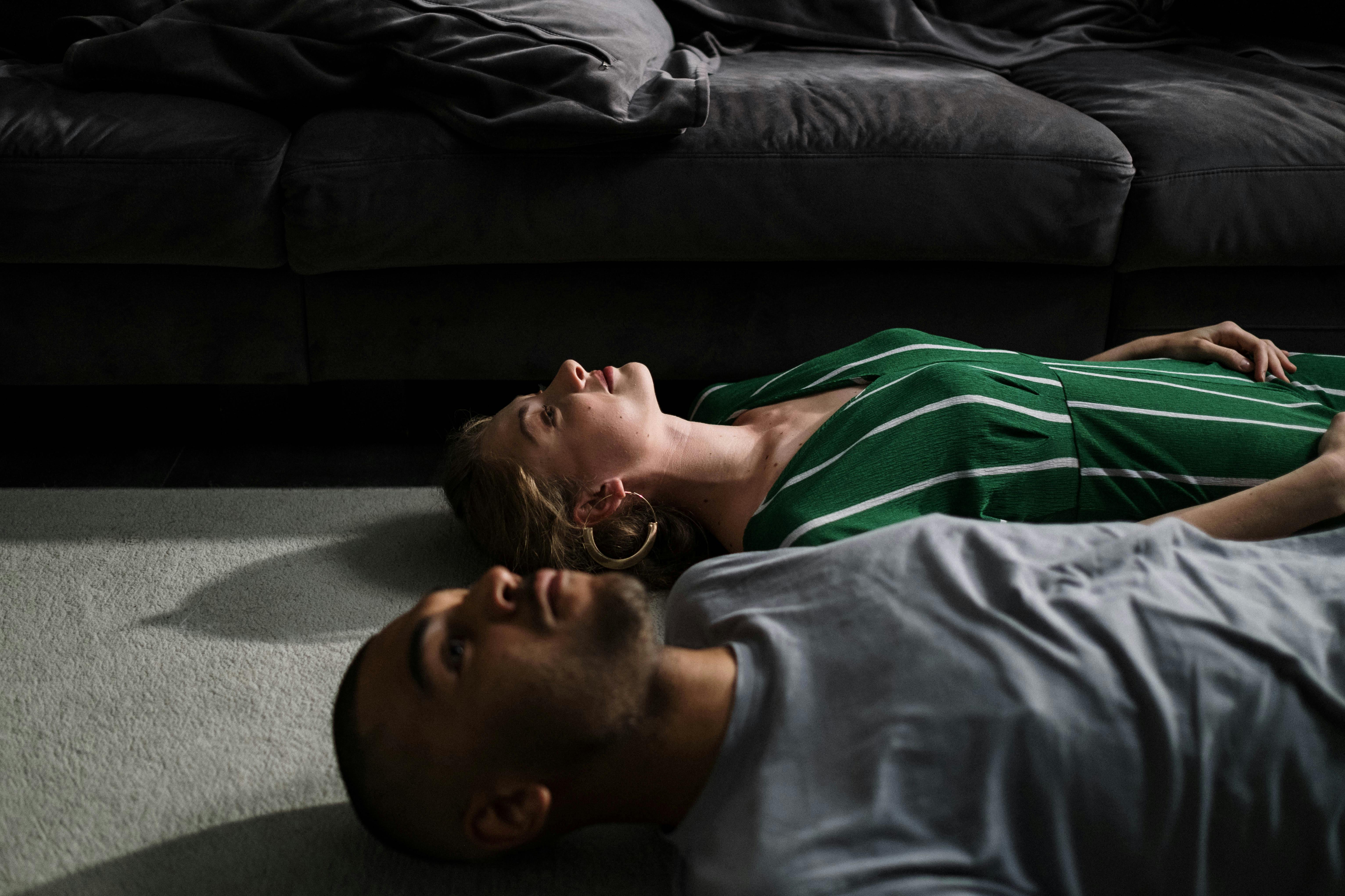 A Couple Lying Down on the Floor · Free Stock Photo