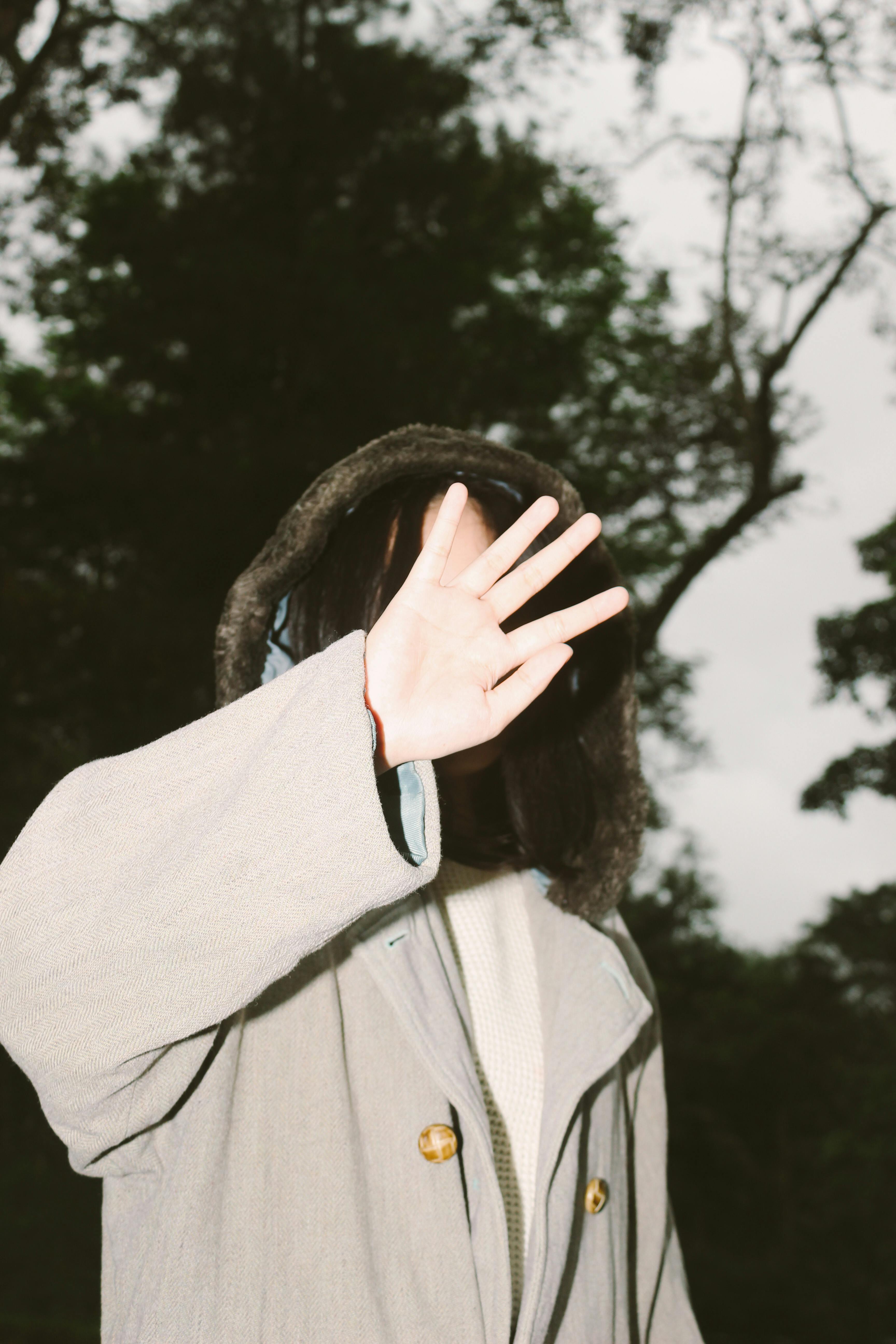 A Person Covering His Face with His Hand · Free Stock Photo