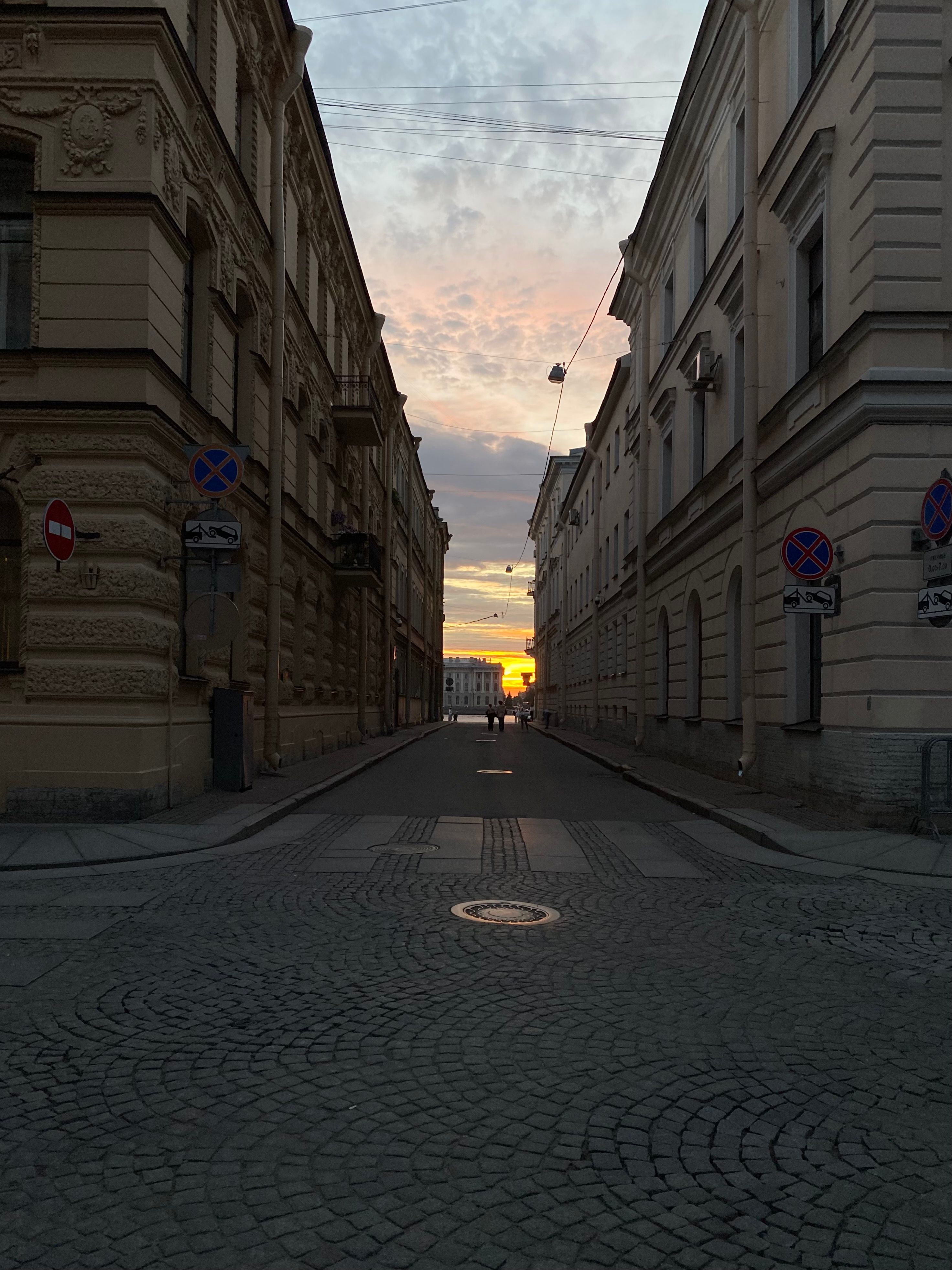 Gray Concrete Road Between Buildings · Free Stock Photo