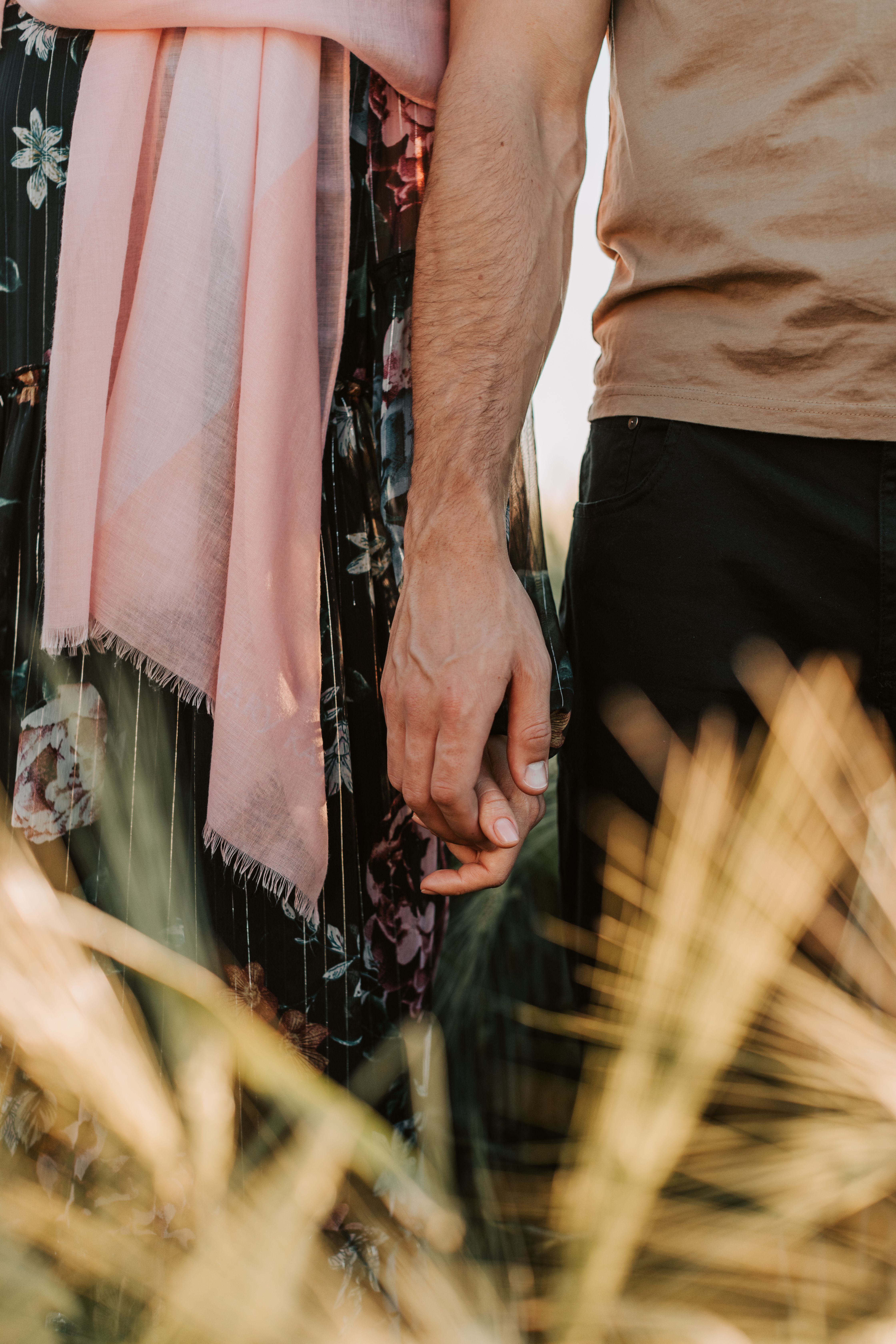 Man and Woman Holding Hands · Free Stock Photo