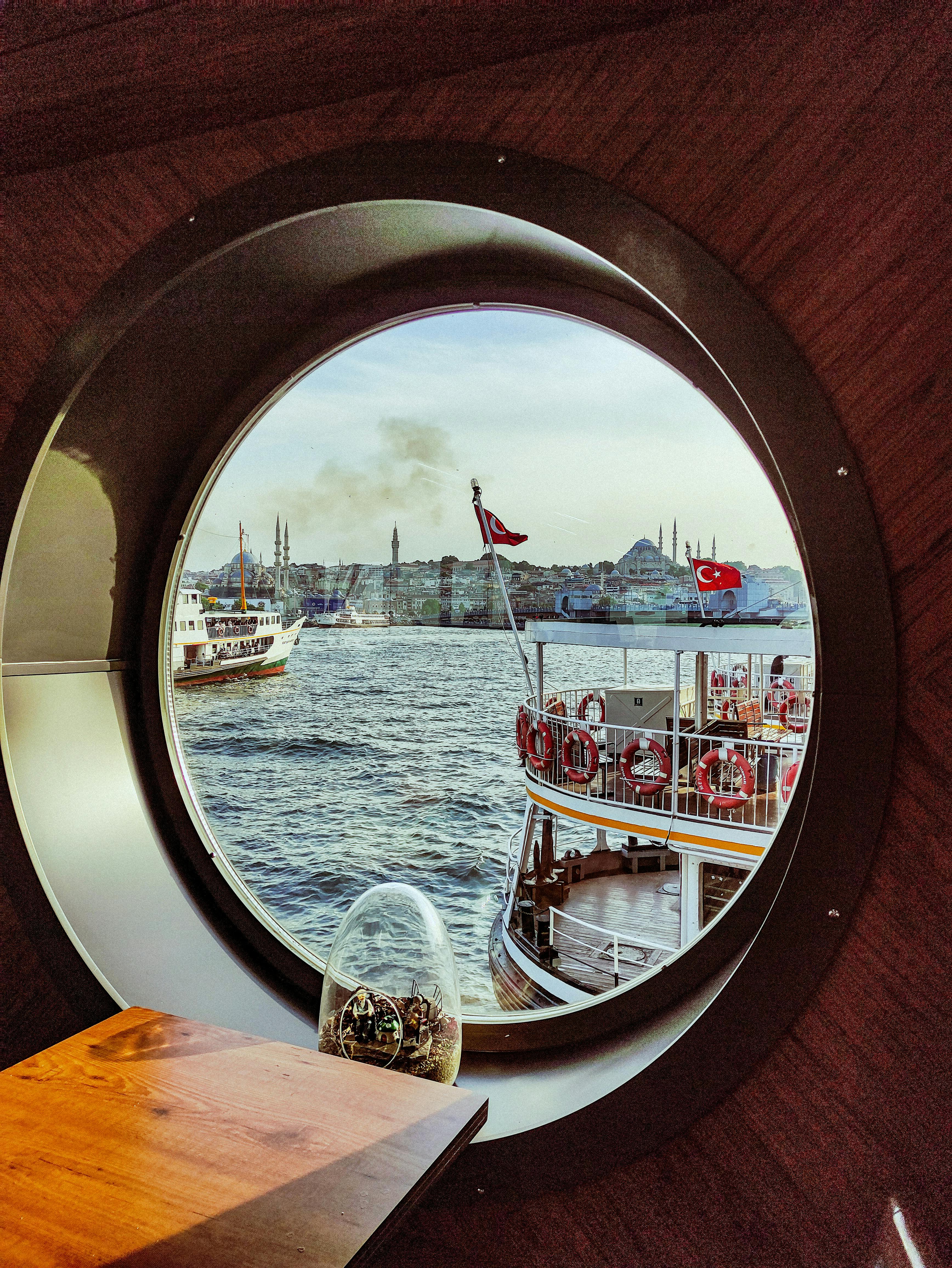 Cruise Ships Sailing Through Bay Seen From Ships Window · Free Stock Photo