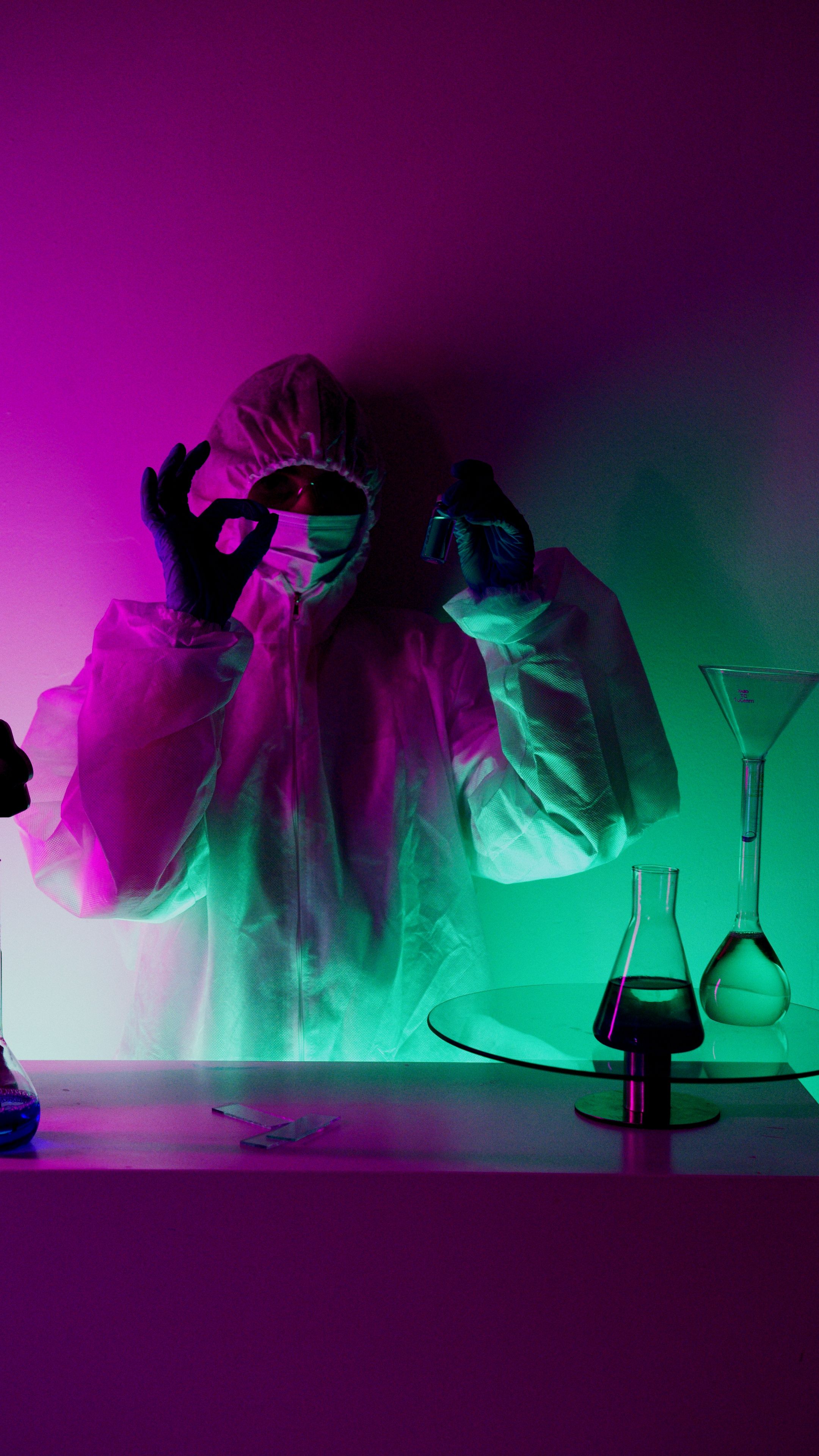 Person in Personal Protective Equipment Standing Inside a Laboratory ...