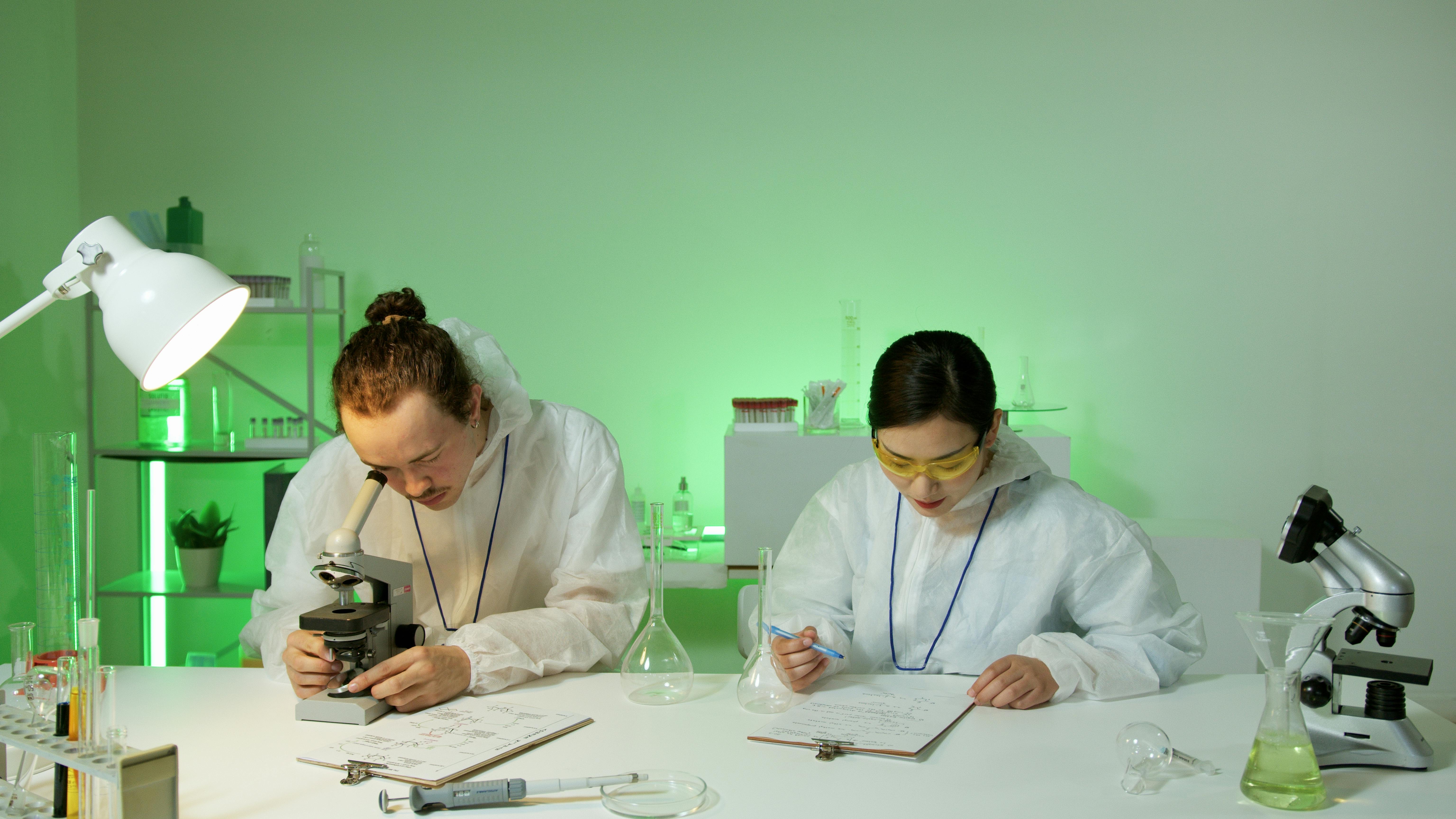 People in White Overalls Working in a Laboratory · Free Stock Photo