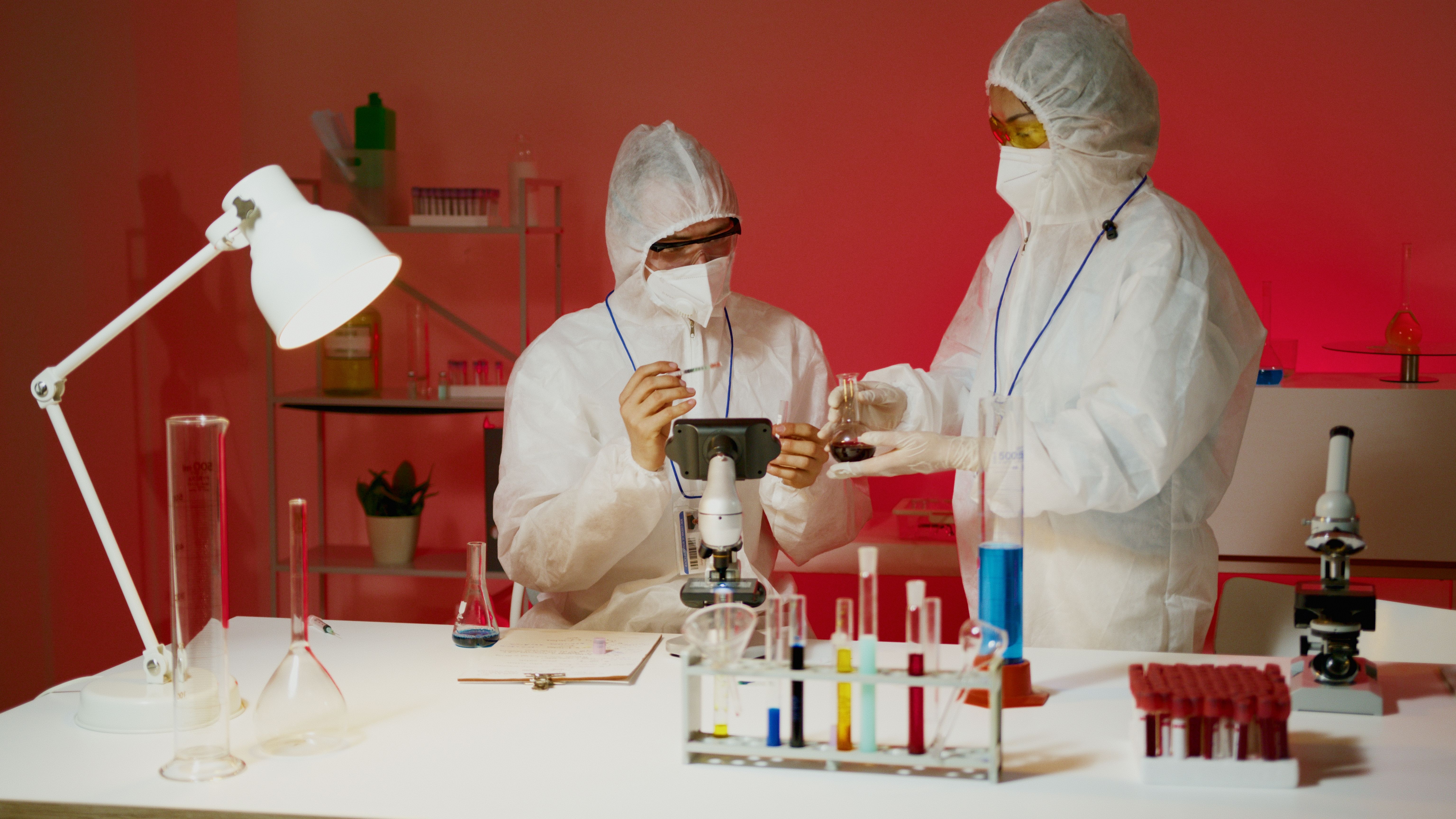 Person Holding Laboratory Flask · Free Stock Photo