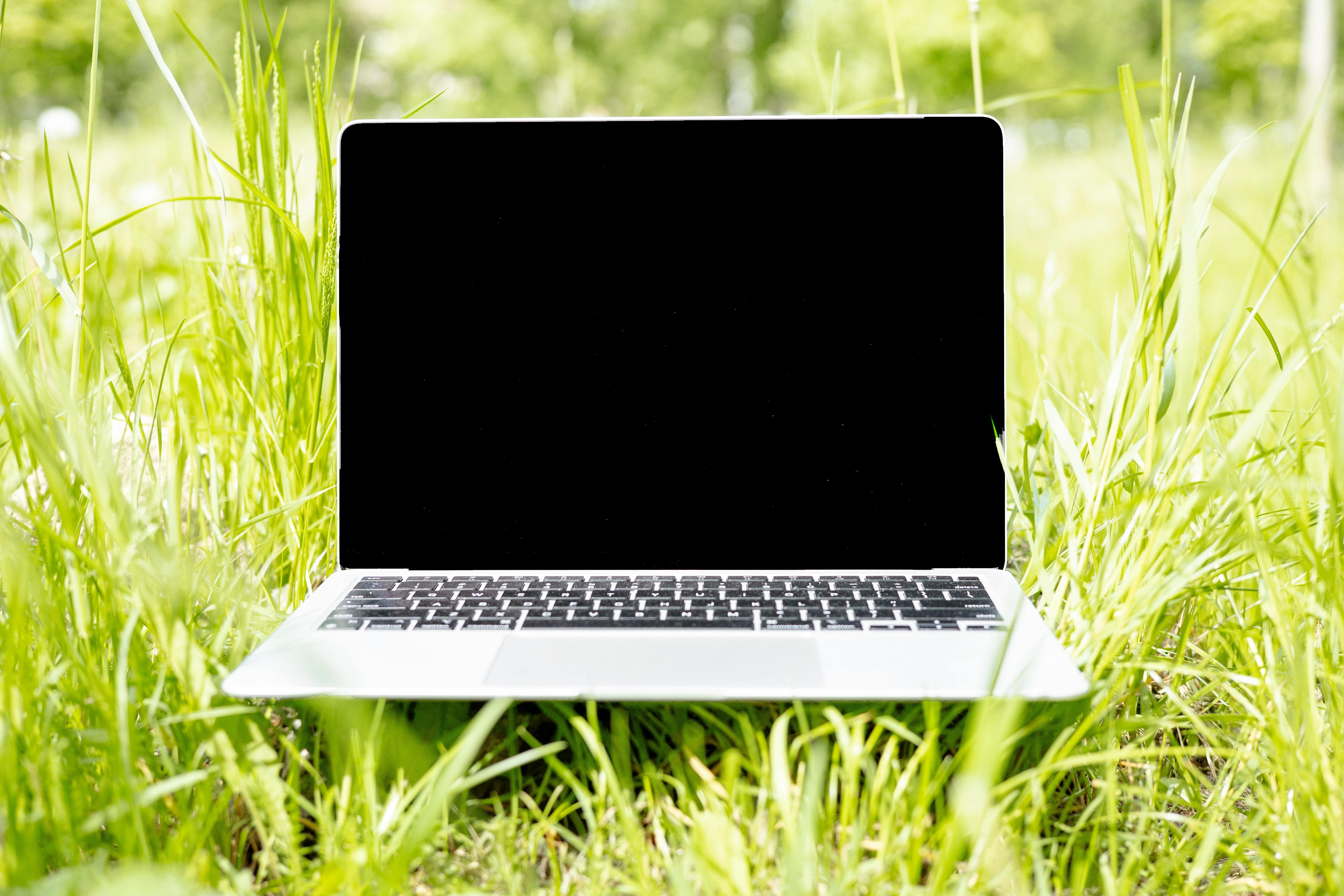Laptop on Green Grass · Free Stock Photo
