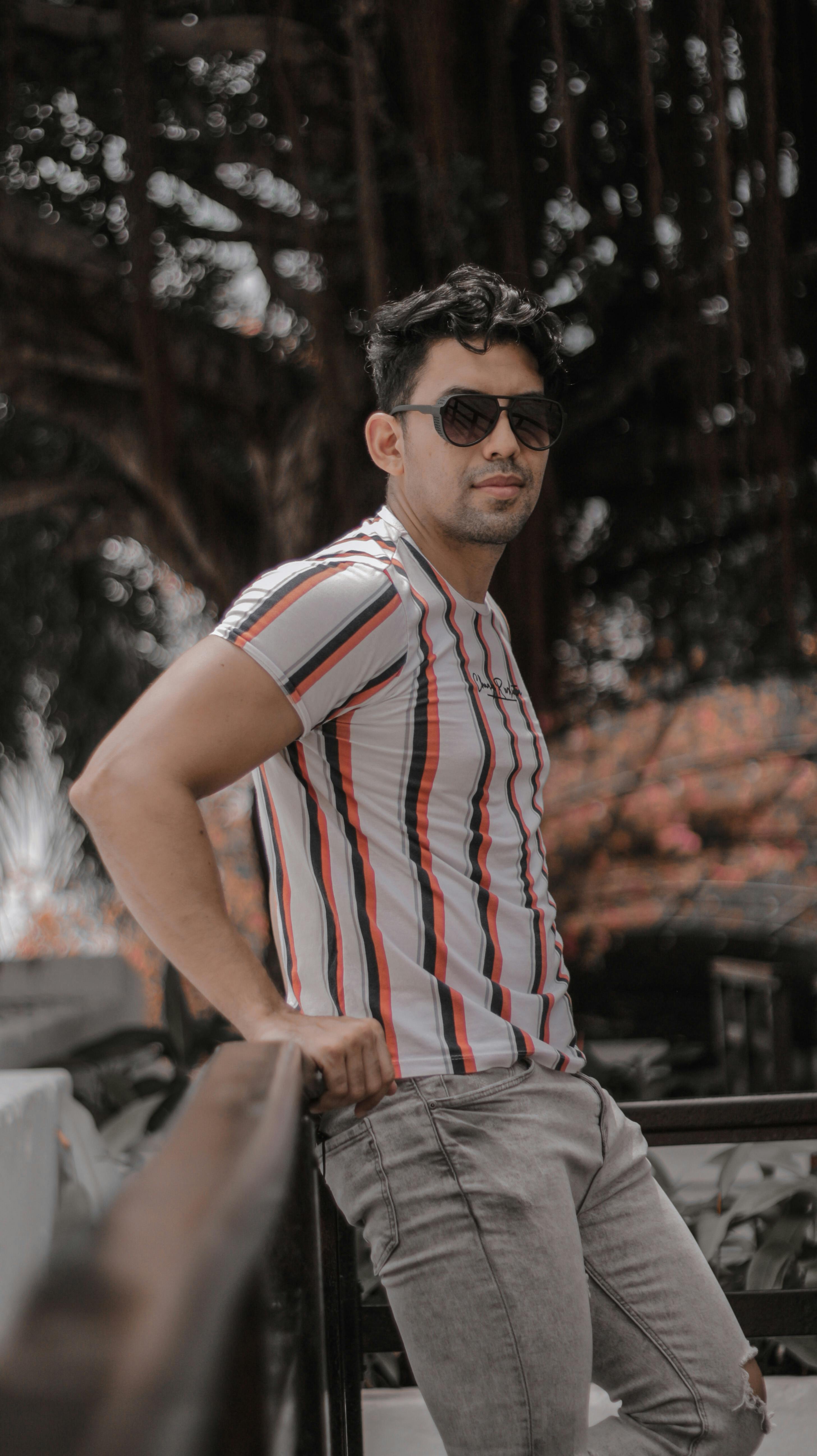 Man Posing by a Railing · Free Stock Photo