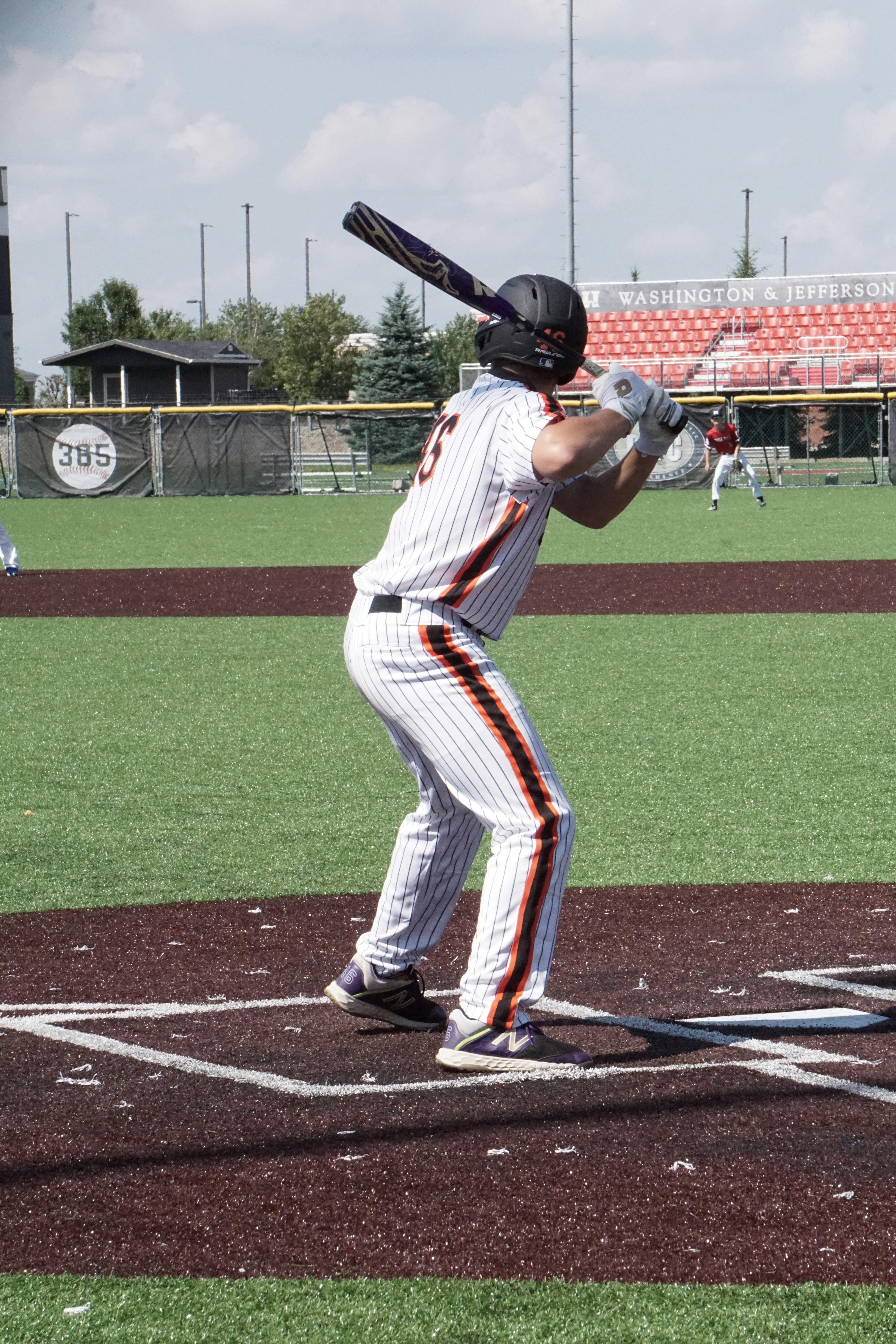 Man Playing Baseball on a Stadium · Free Stock Photo
