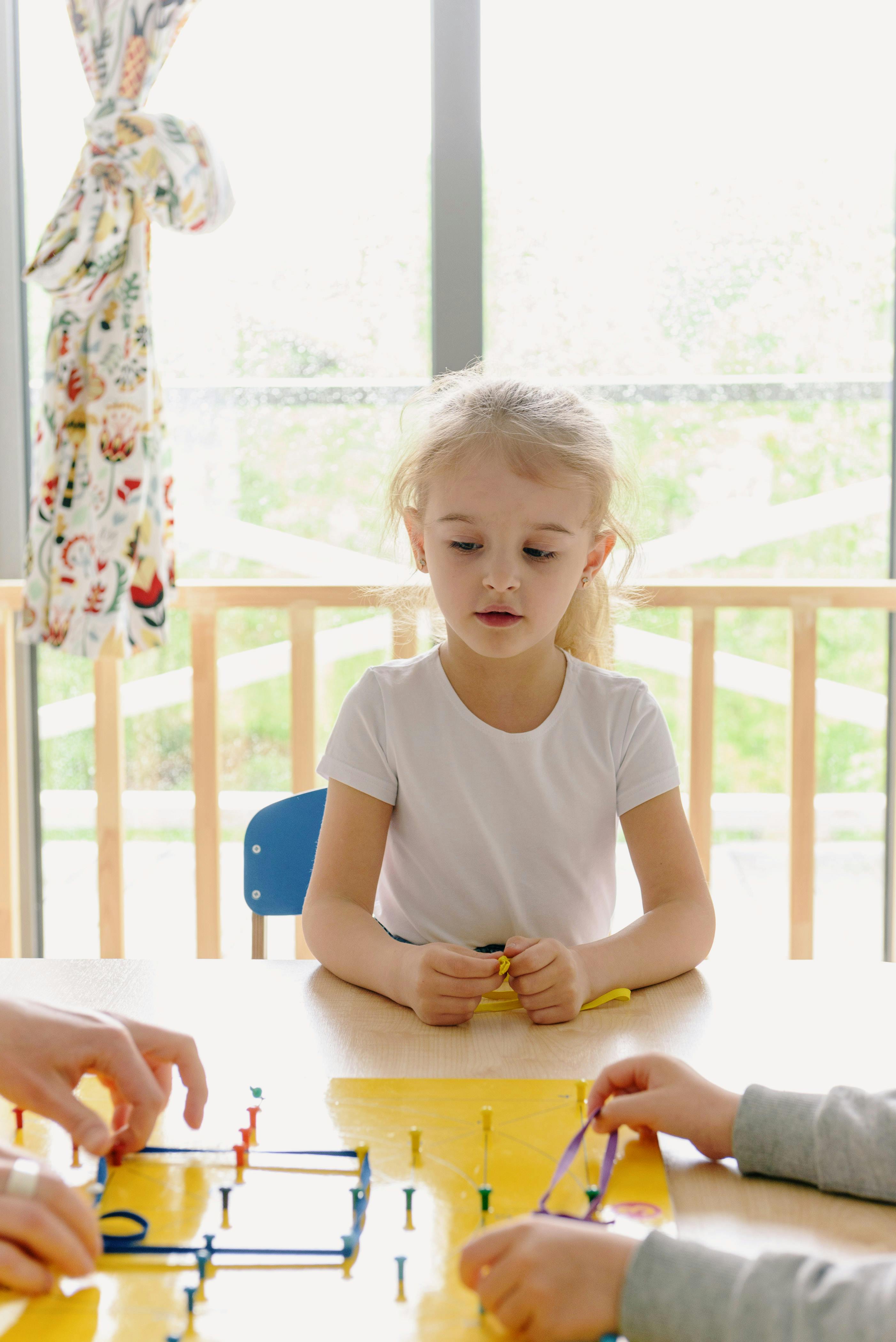 Kids Playing at the Table · Free Stock Photo