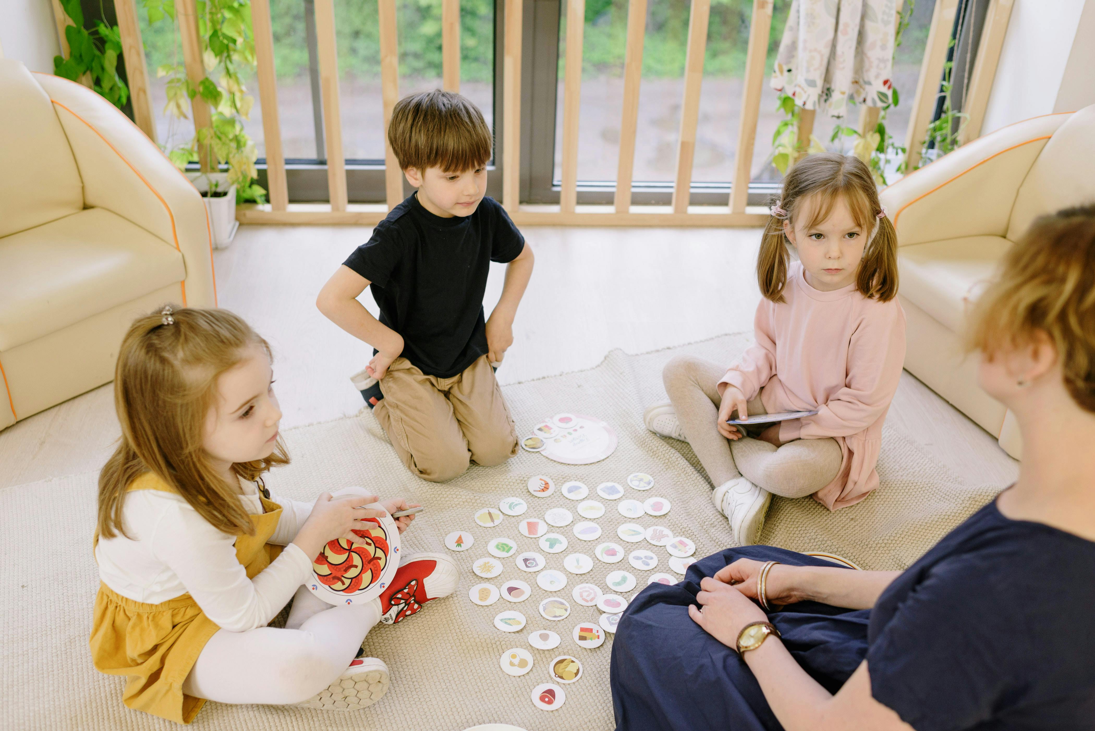 Three Children Playing Operation Toy · Free Stock Photo
