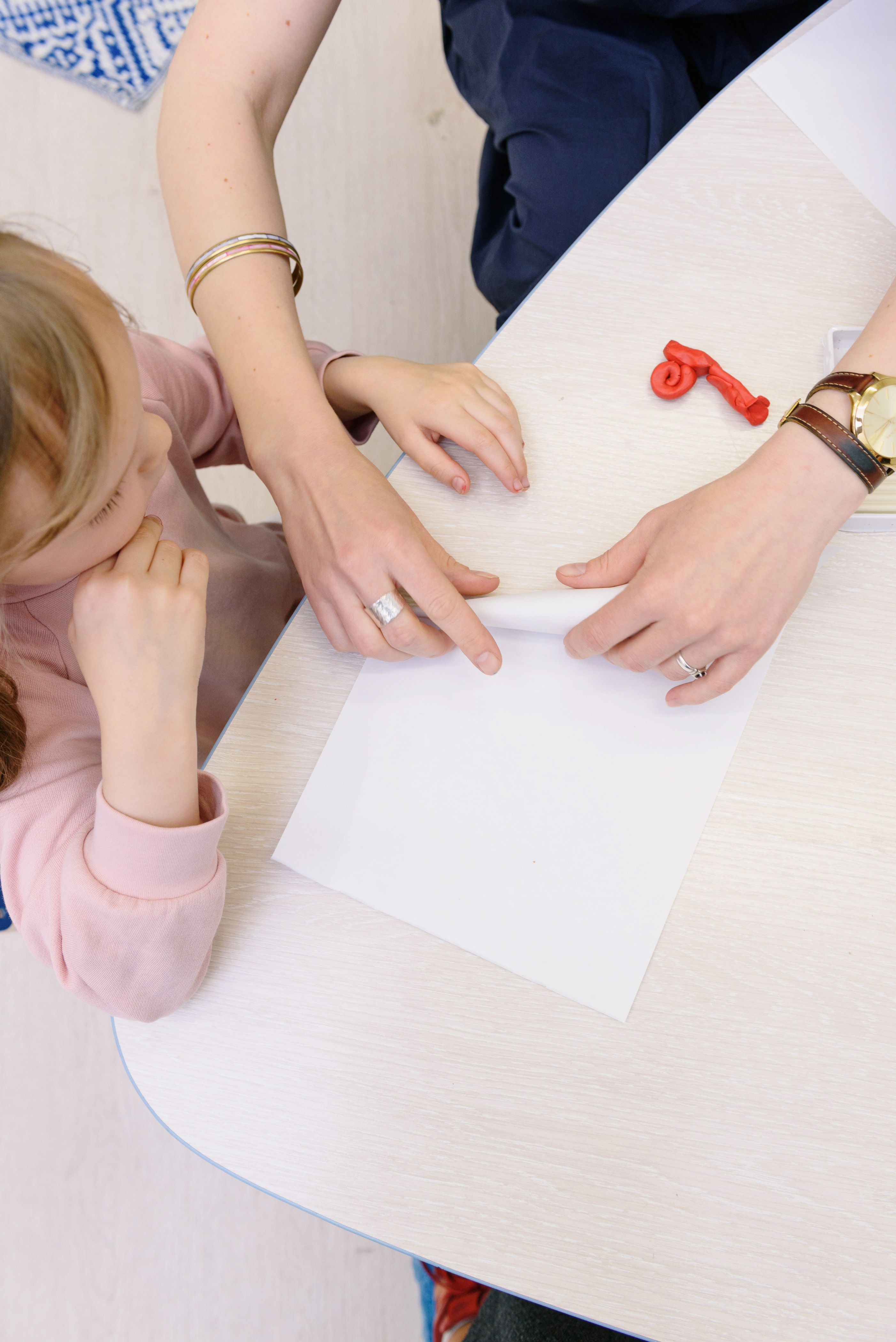 A Girl Coloring a White Paper · Free Stock Photo
