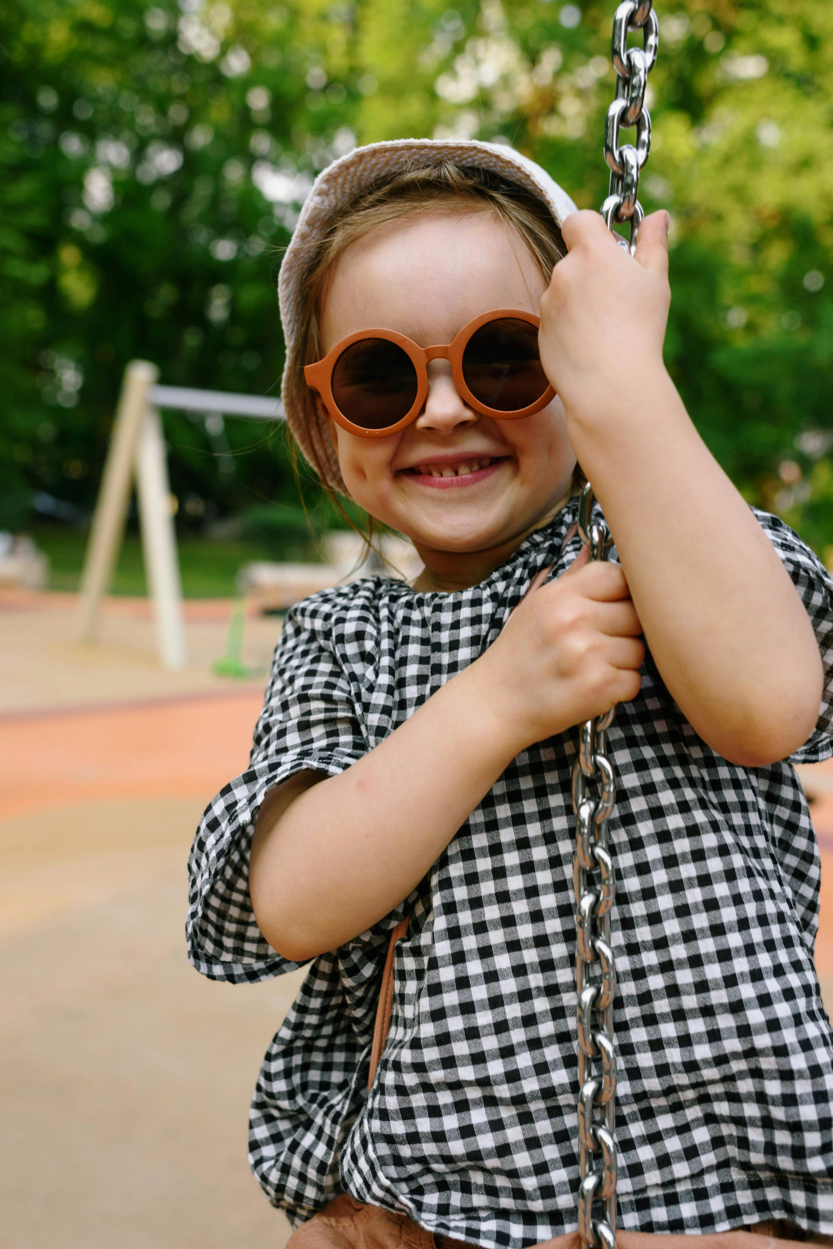 Smiling Girl Holding Chain · Free Stock Photo
