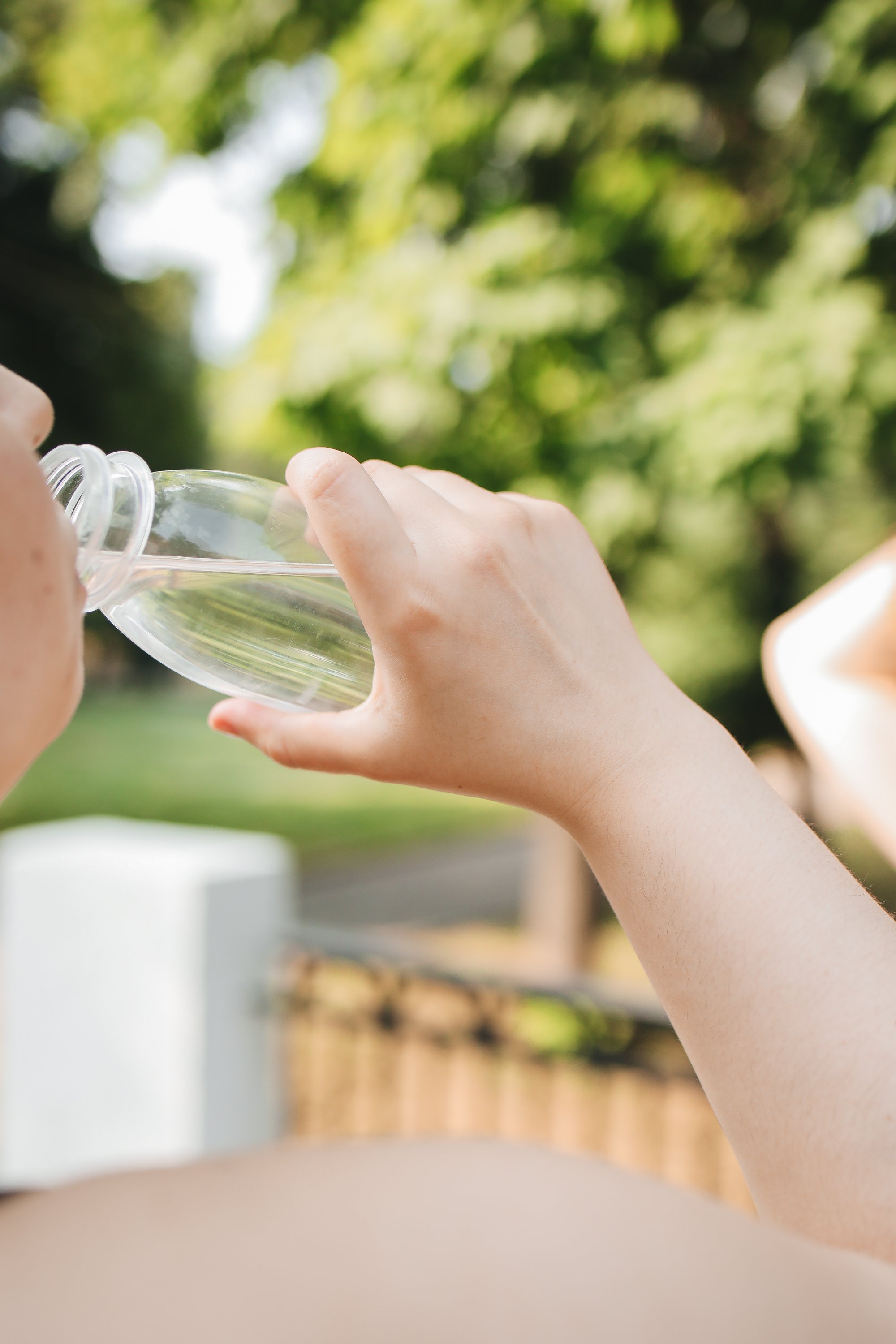 Woman Drinking Water From Glass Bottle · Free Stock Photo