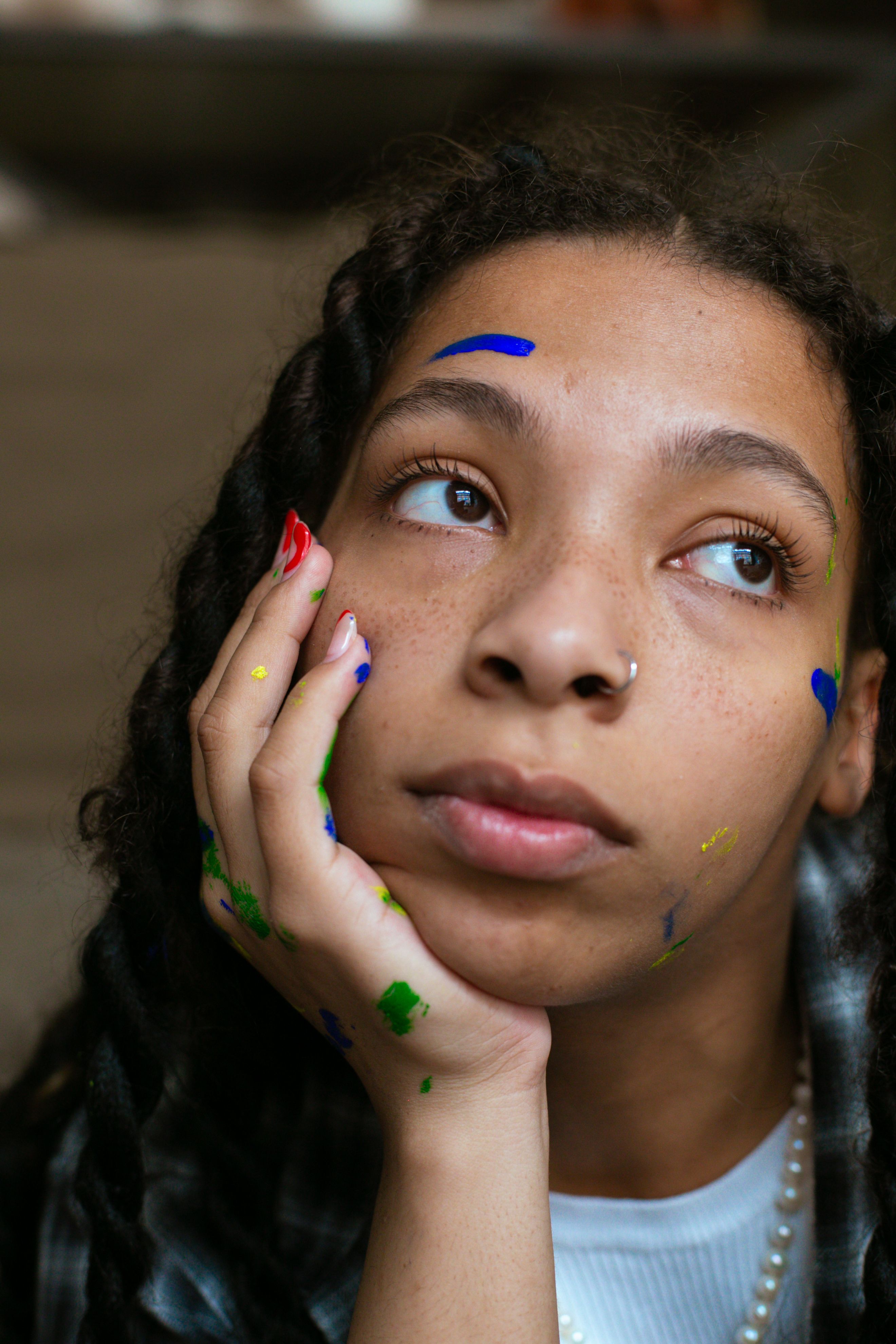 Girl with Paint Stains on Hear Face and Hand · Free Stock Photo
