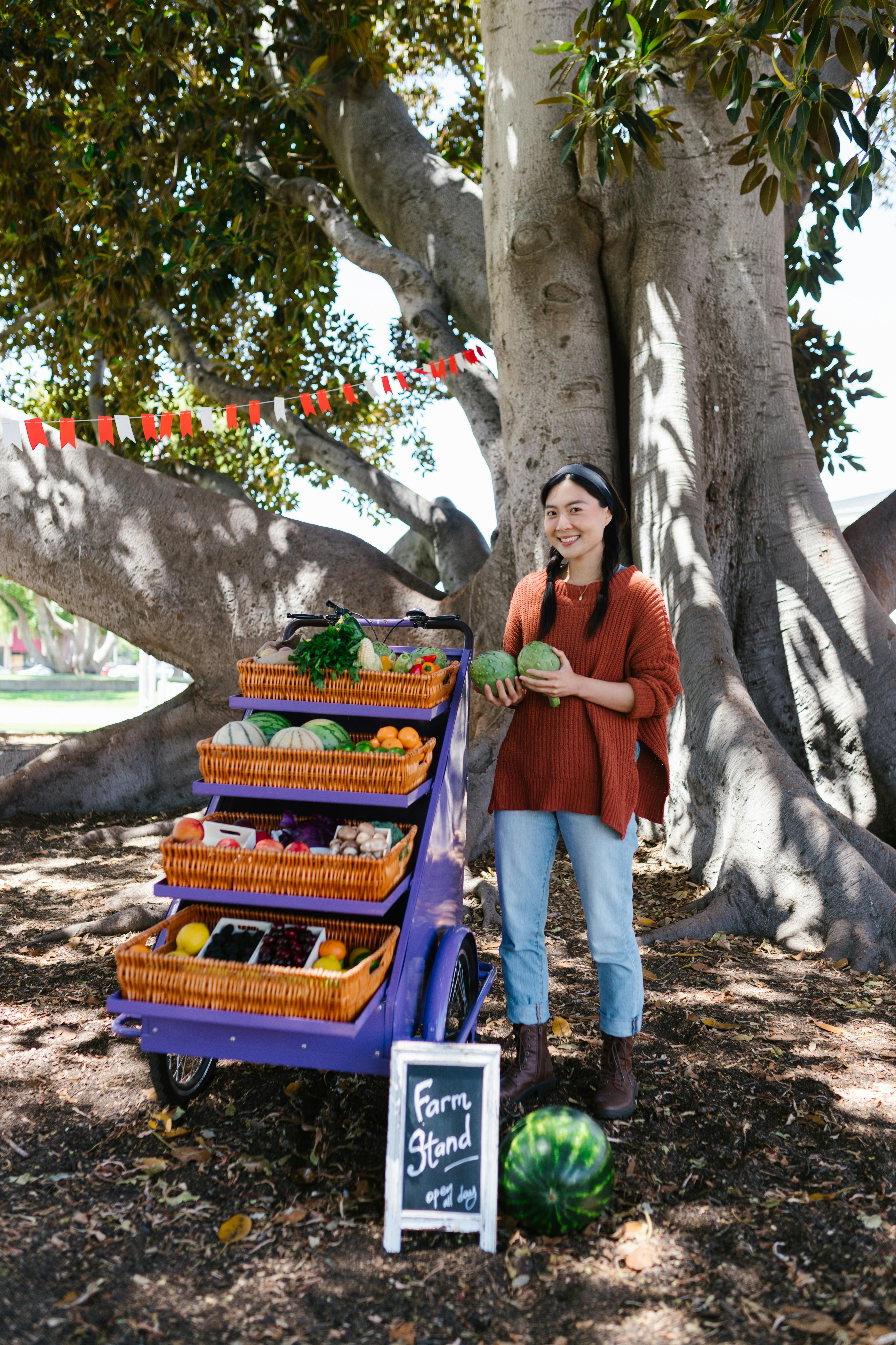 Woman Selling Crops on Organic Market Stall · Free Stock Photo