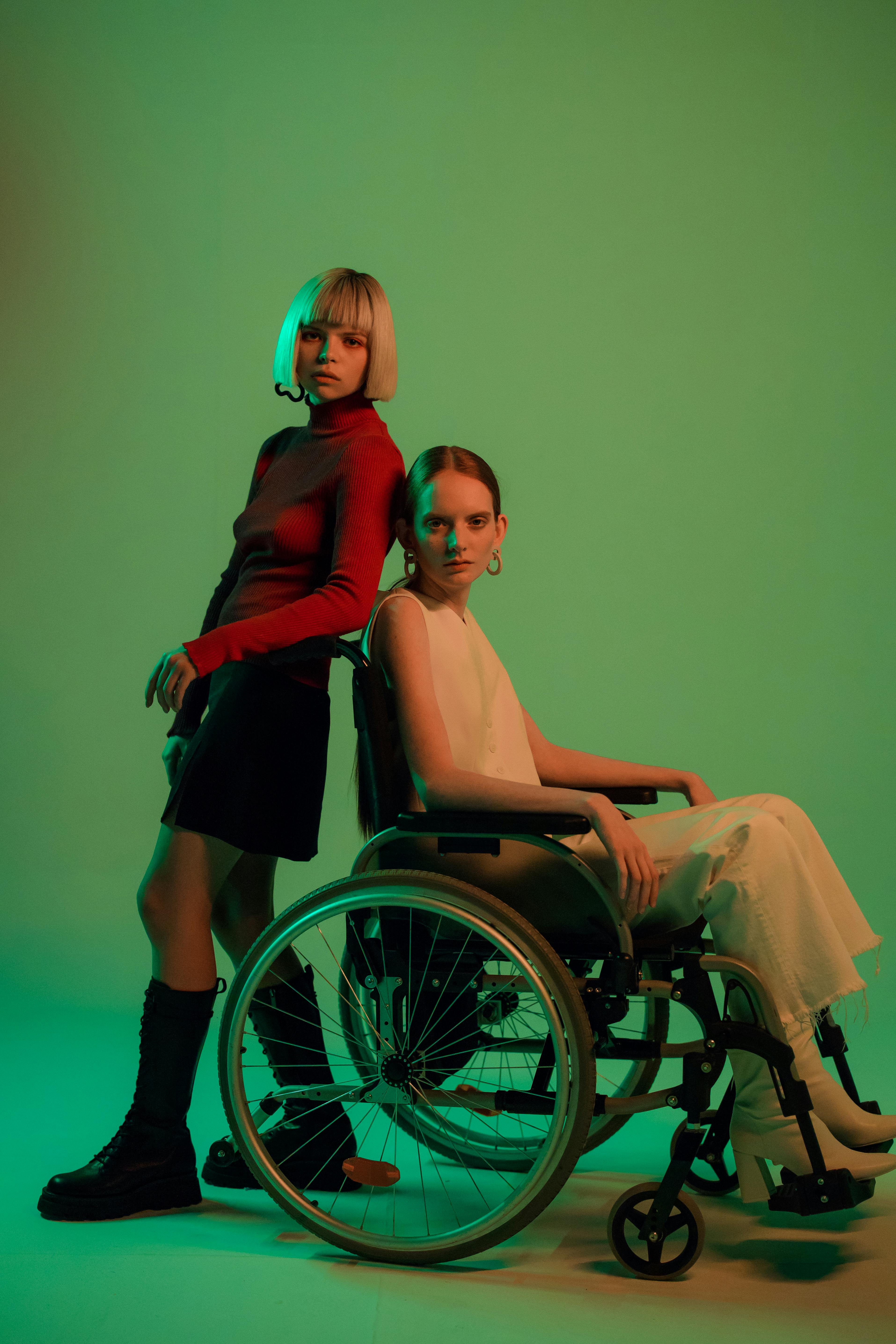 Women in Trendy Outfits Modeling Back to Back · Free Stock Photo