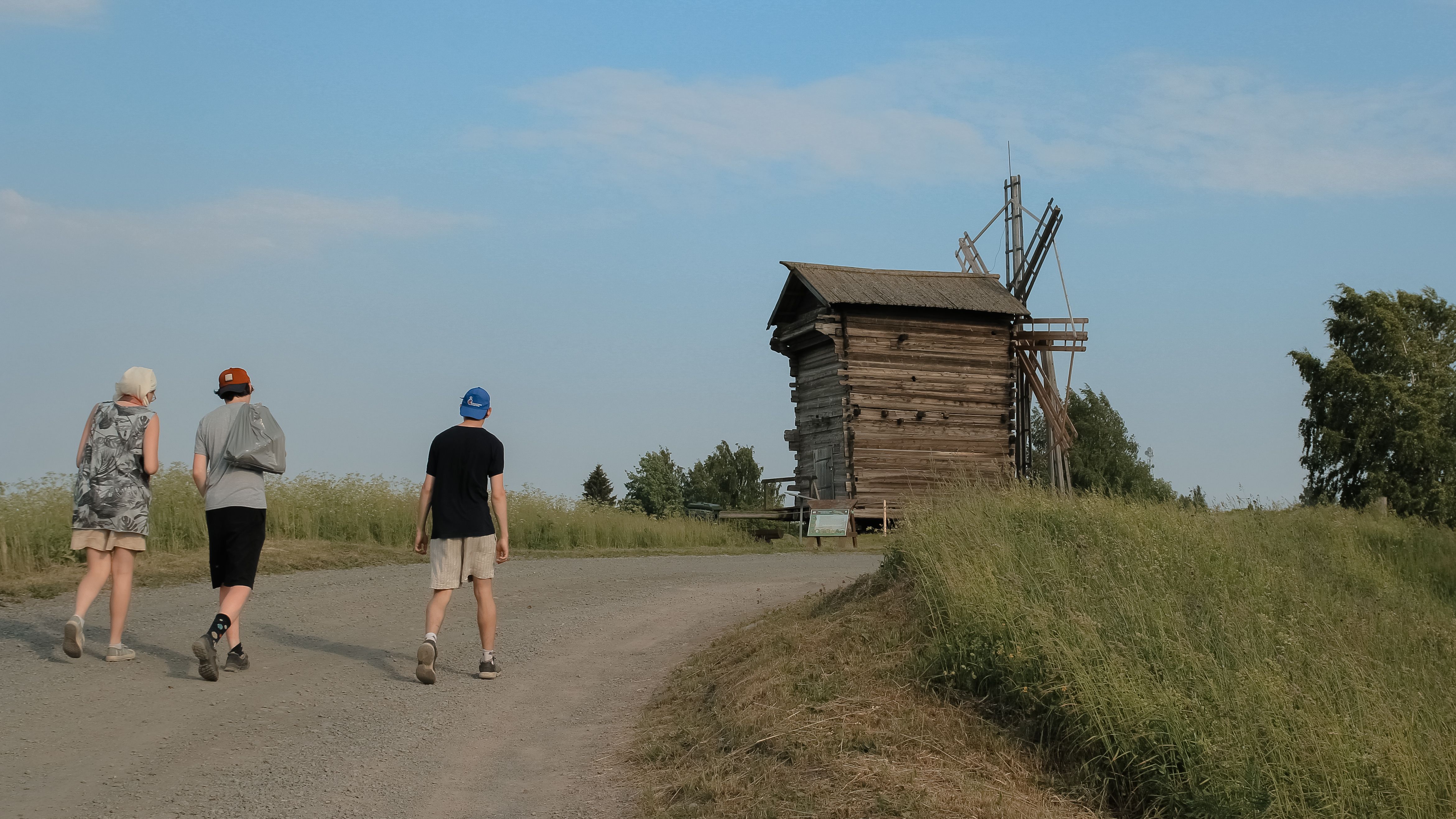 People Going to the Wooden Windmill · Free Stock Photo