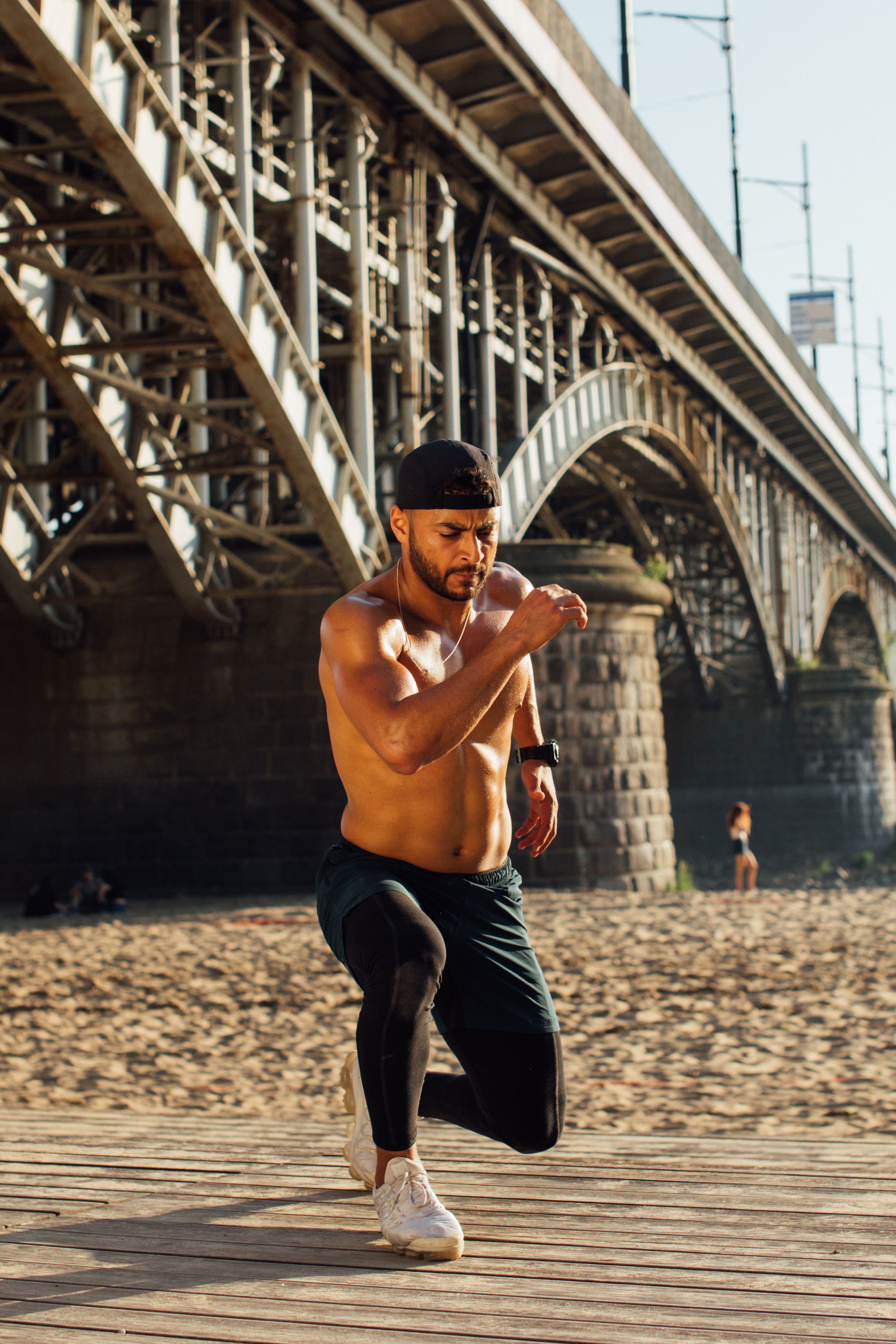 A Shirtless Man Doing a Workout at the Beach · Free Stock Photo