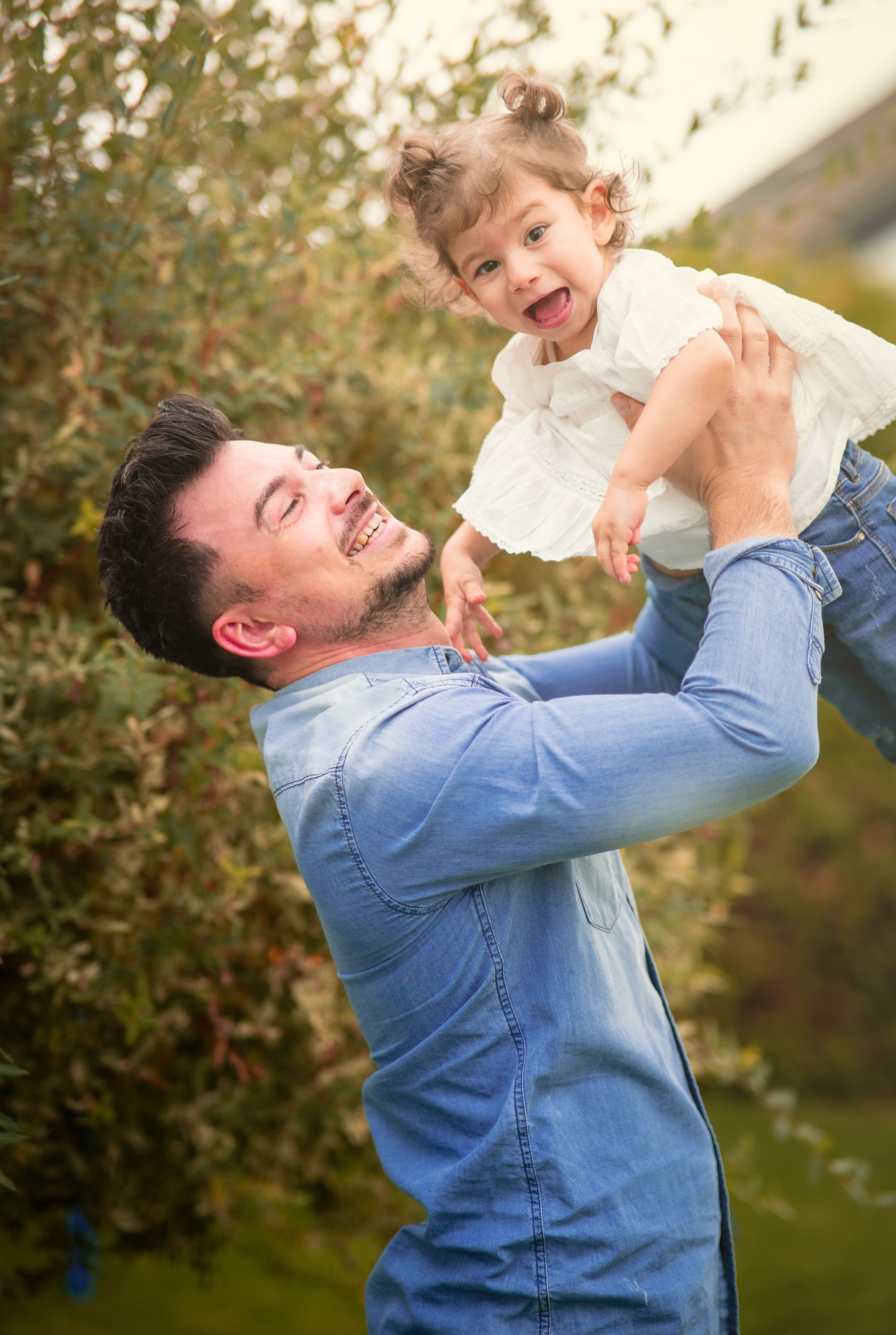 A Man Lifting His Daughter · Free Stock Photo