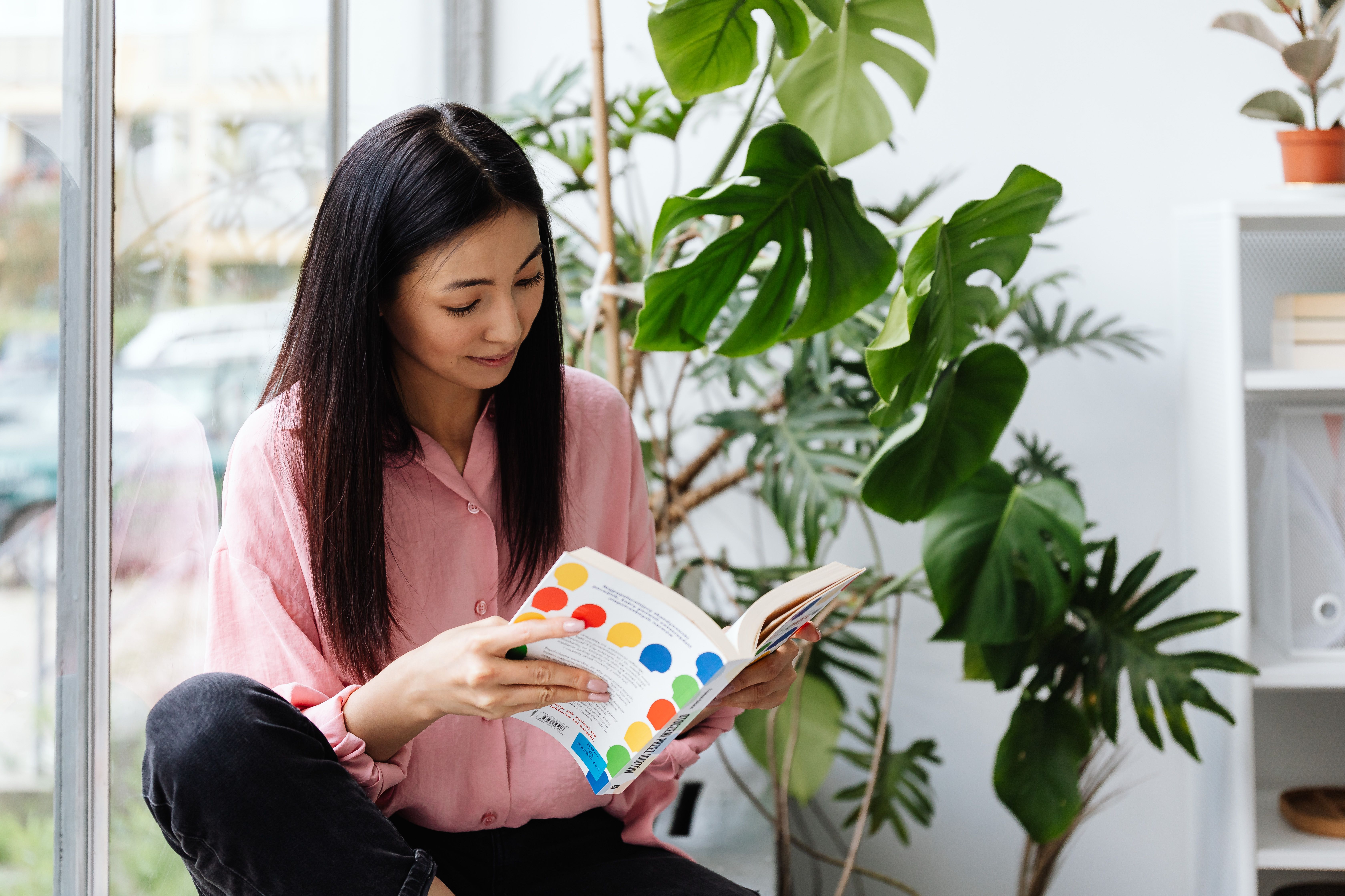 Woman in Pink Shirt Reading A Book · Free Stock Photo