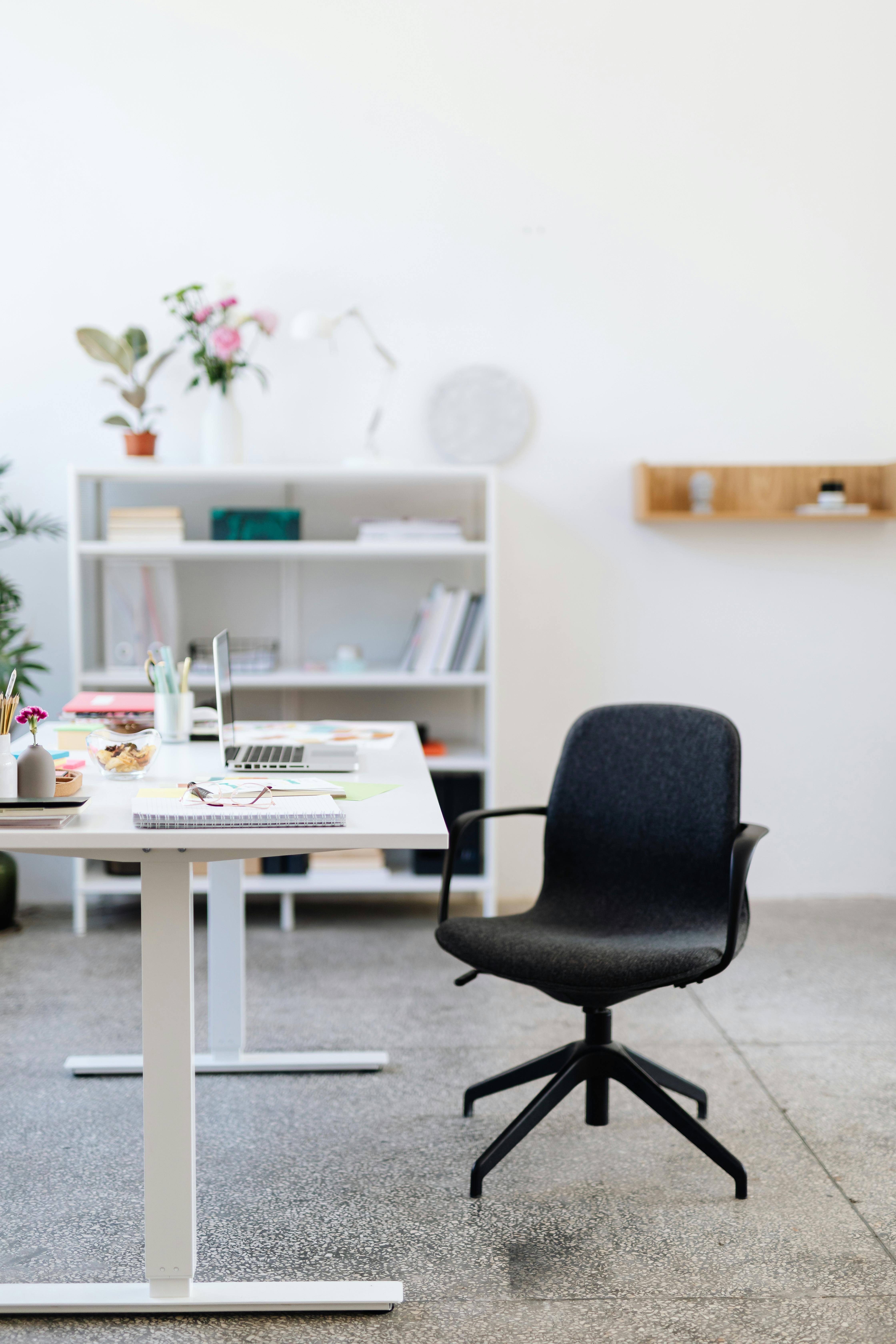 An Office Chair Beside a Work Desk · Free Stock Photo