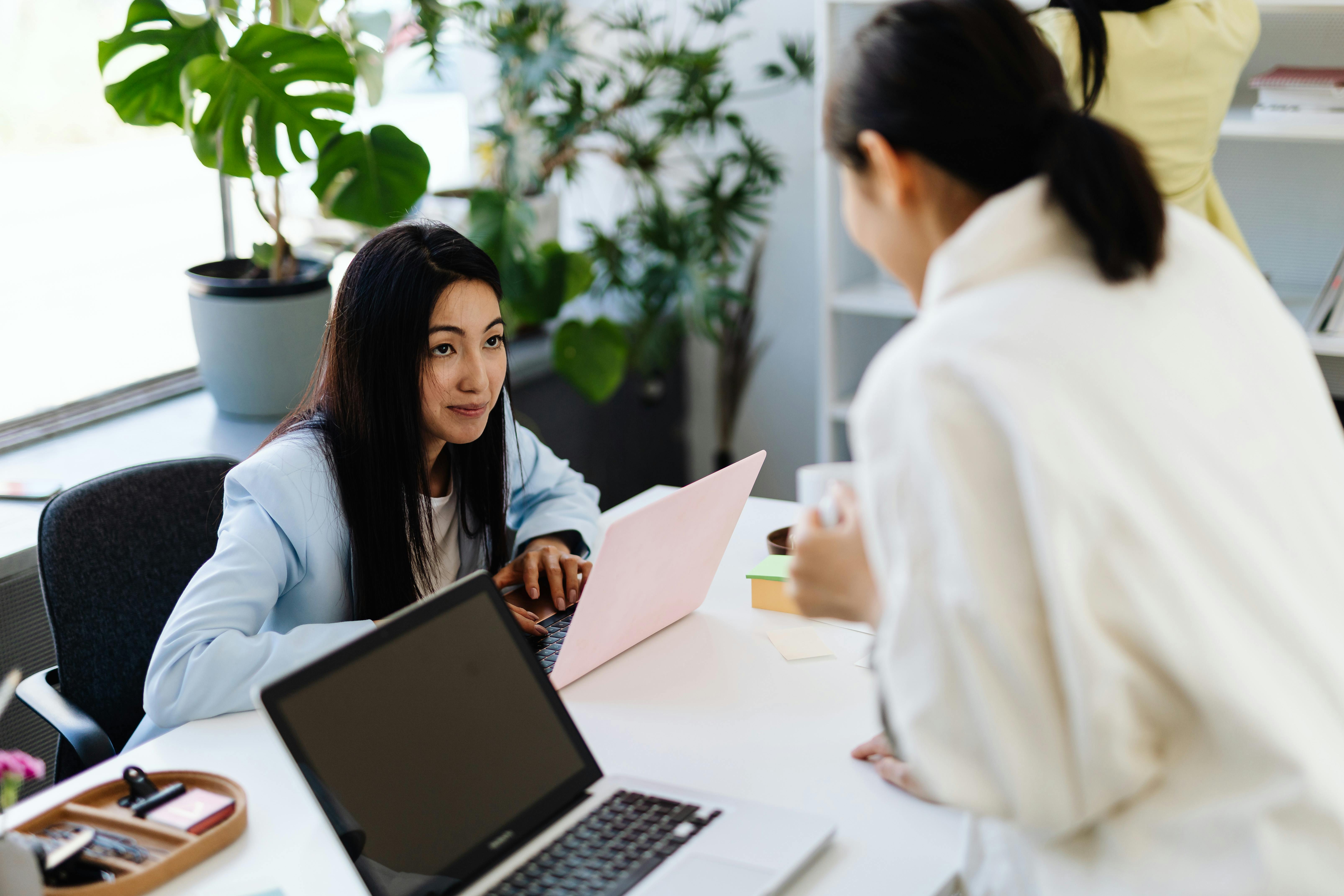 Women Talking in Office · Free Stock Photo