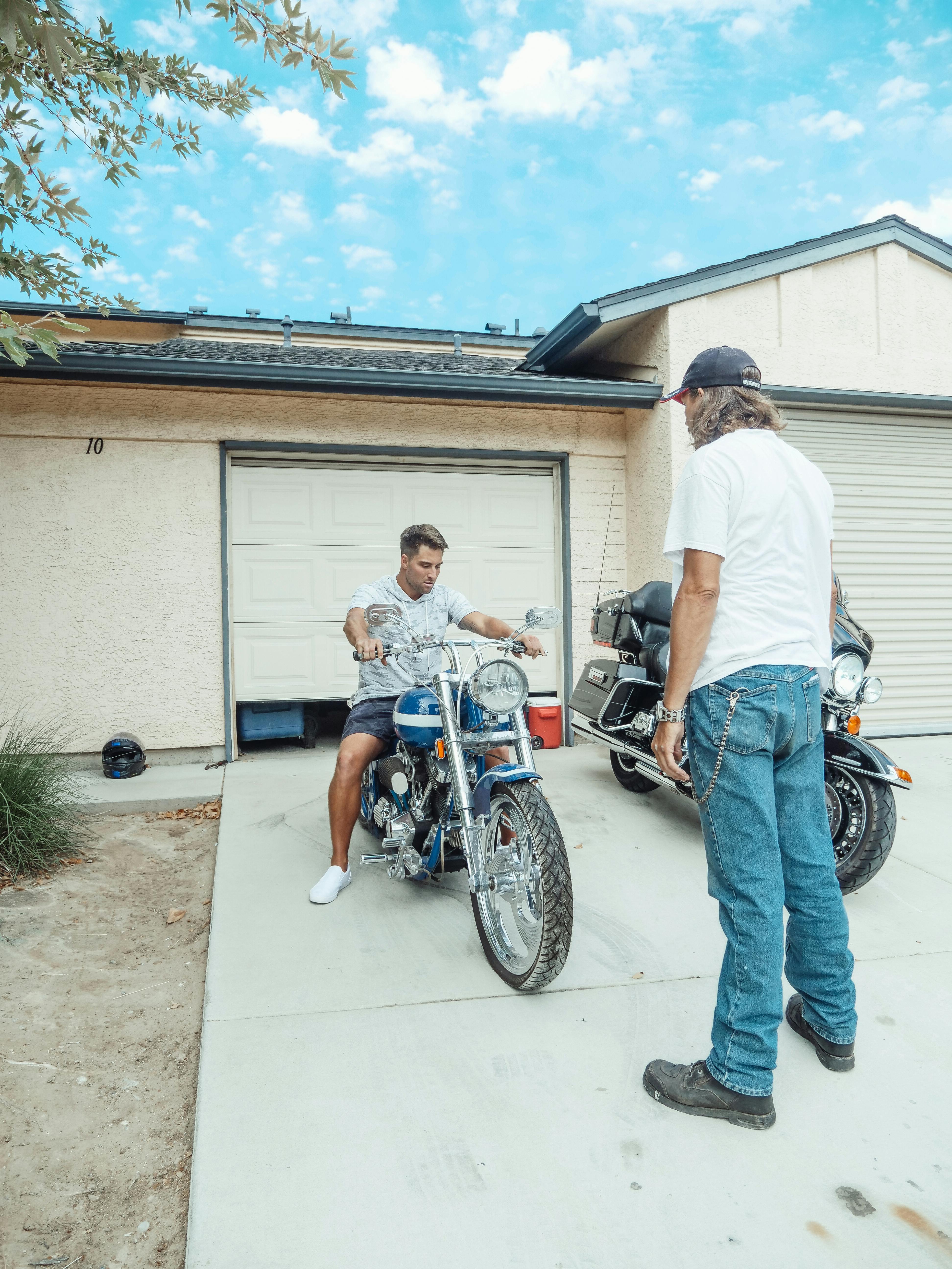 Men Looking at a Motorbike · Free Stock Photo