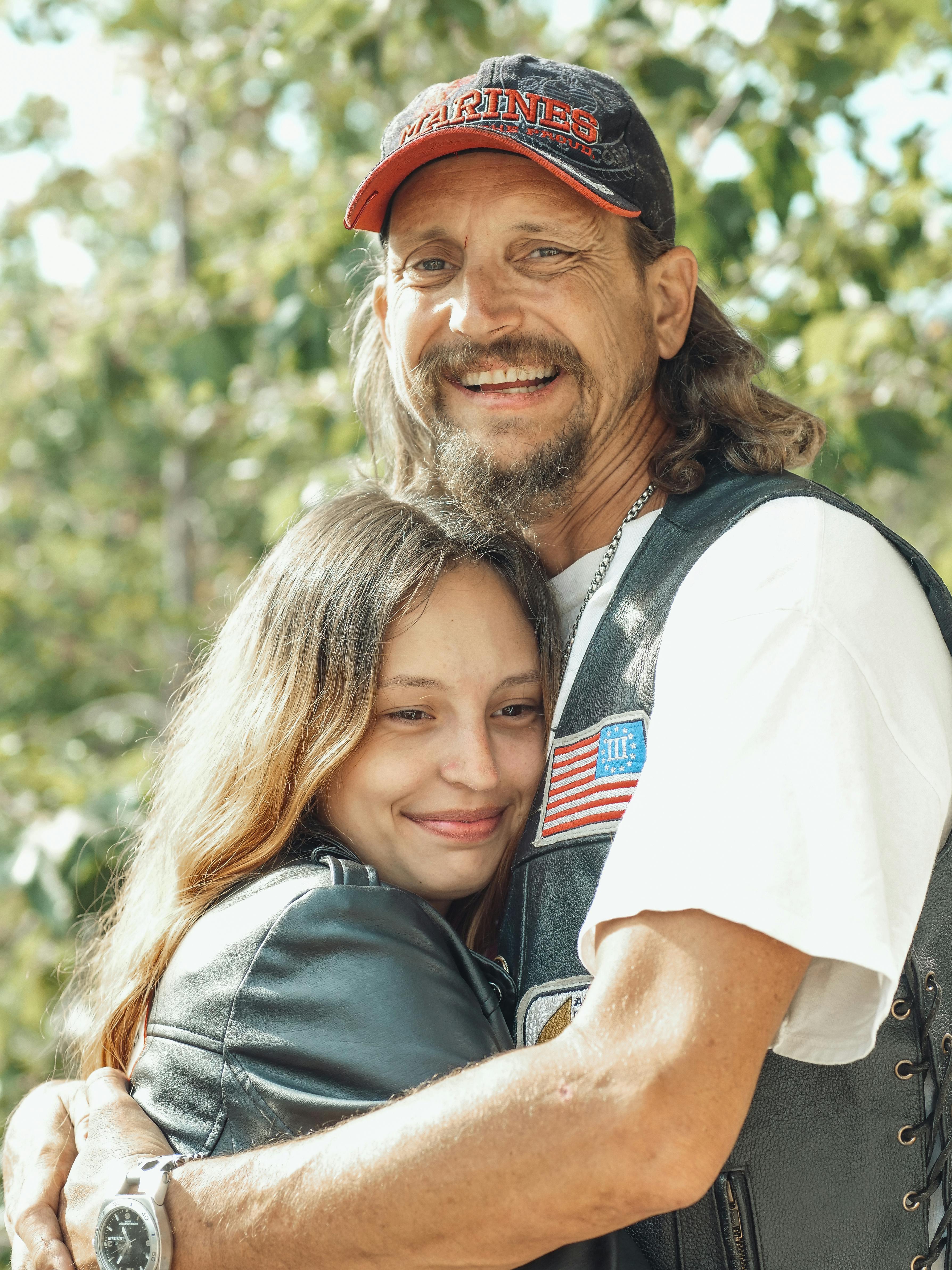 Man Hugging Her Daughter · Free Stock Photo