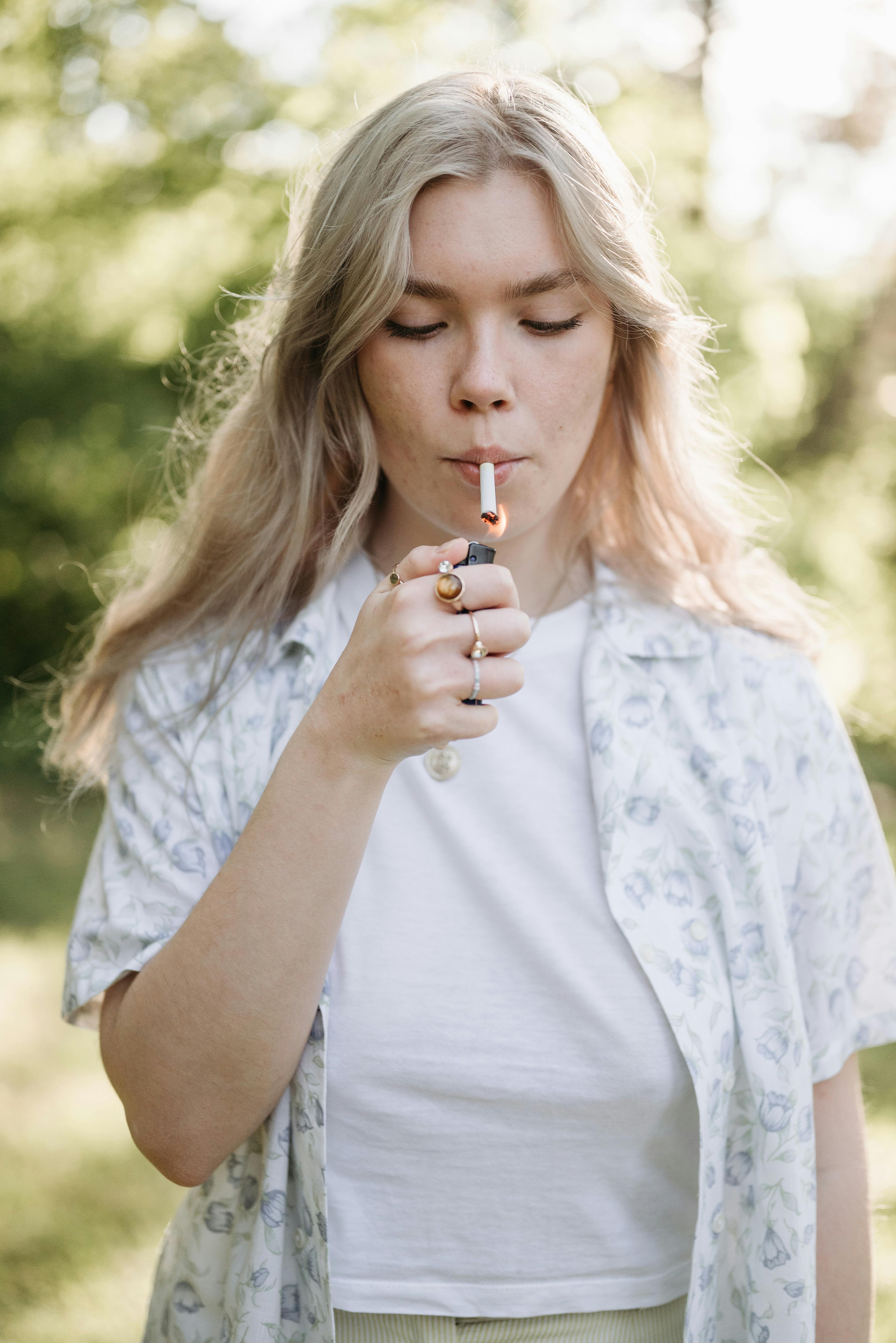 A Person Holding a Cigarette · Free Stock Photo
