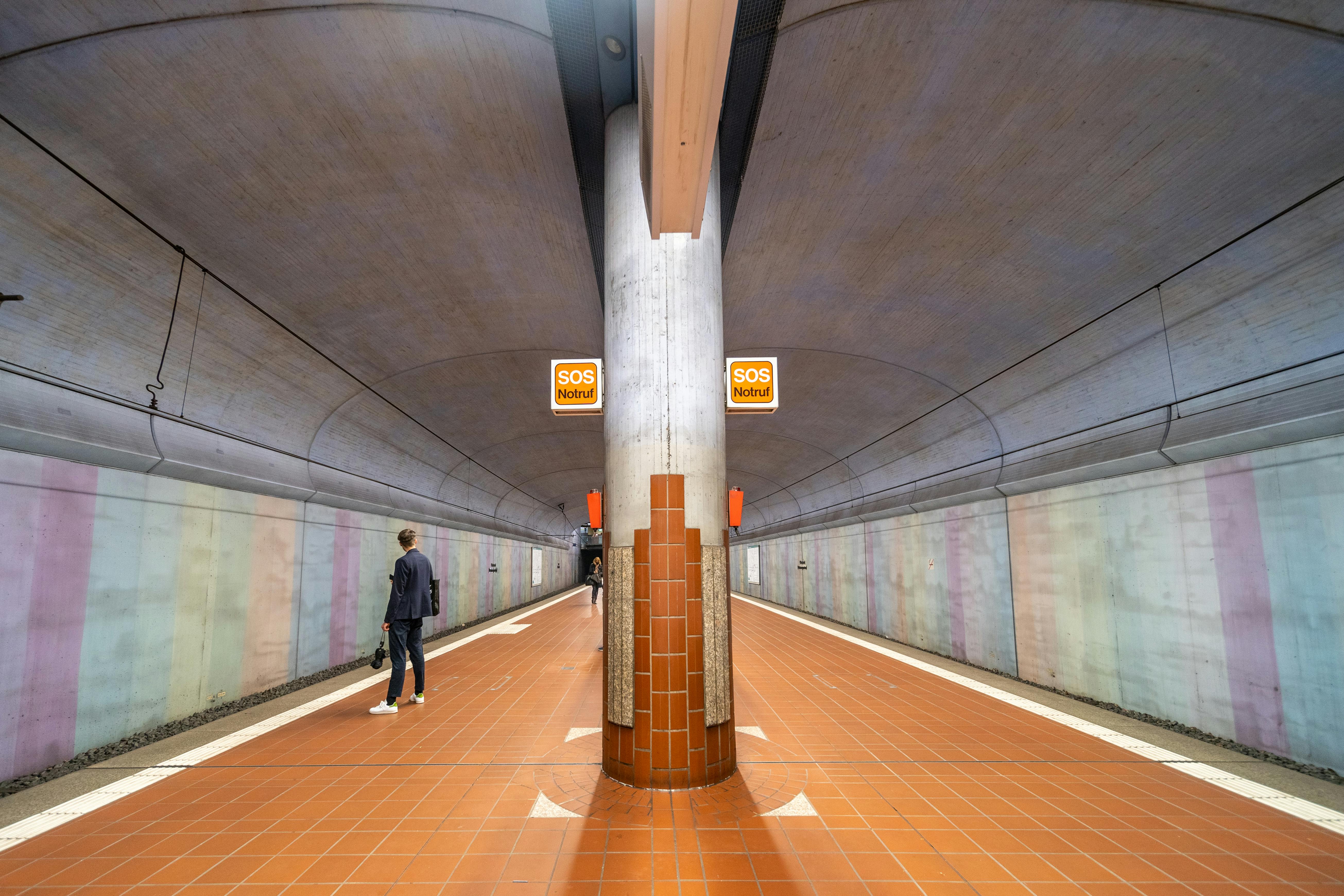 People Walking on Brown Wooden Hallway · Free Stock Photo