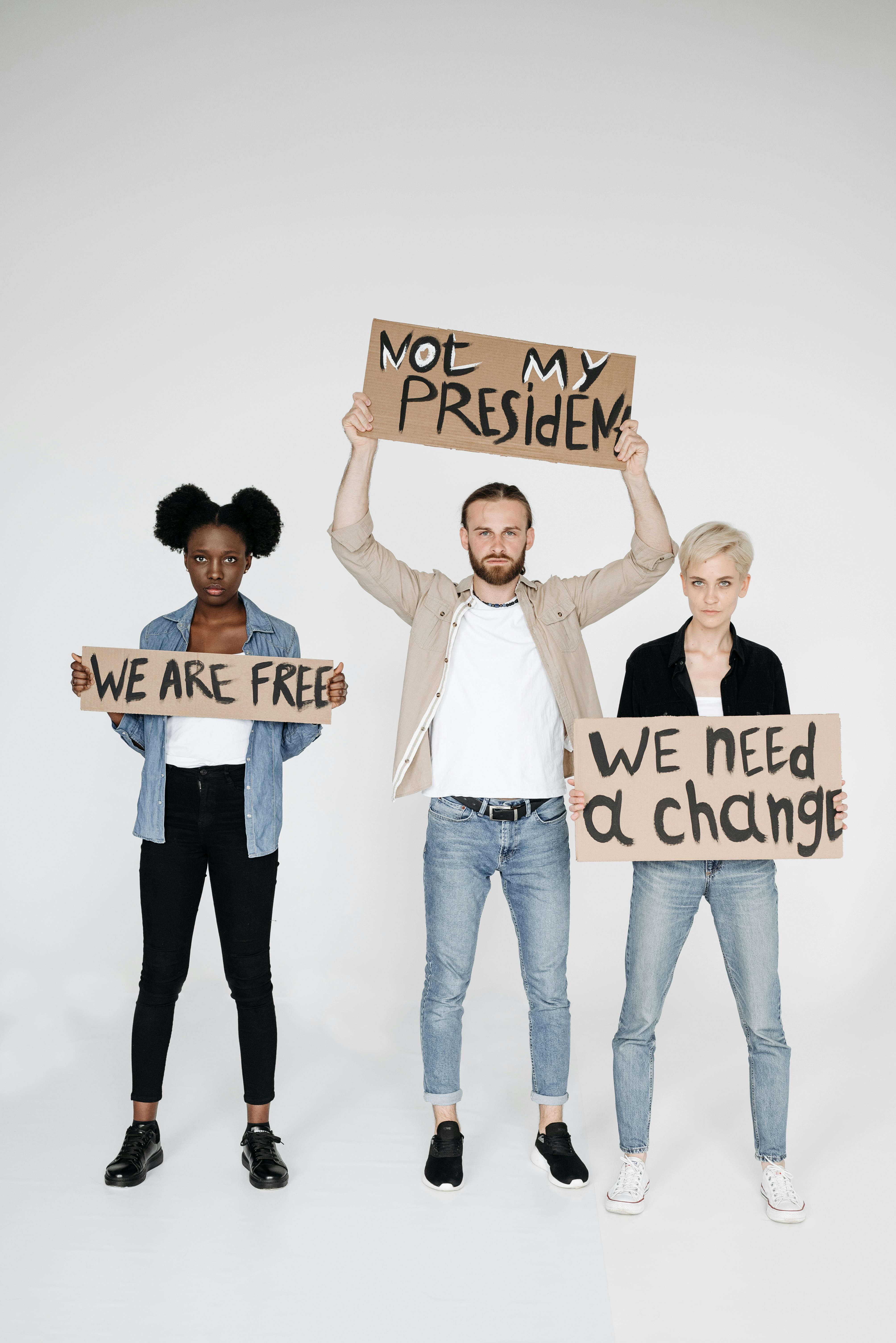 People Holding Protest Signs and Protesting · Free Stock Photo
