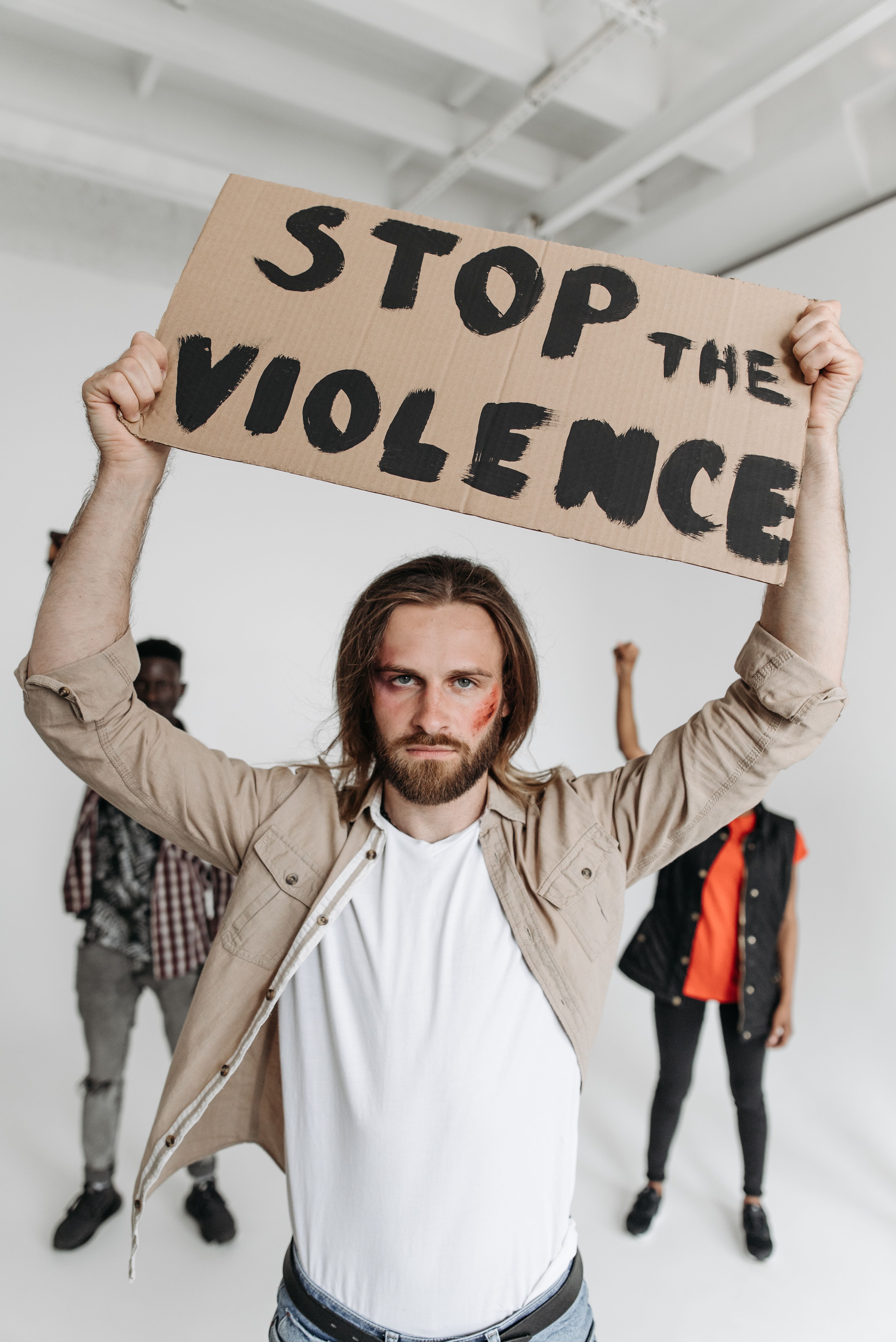 Man Holding a Placard · Free Stock Photo