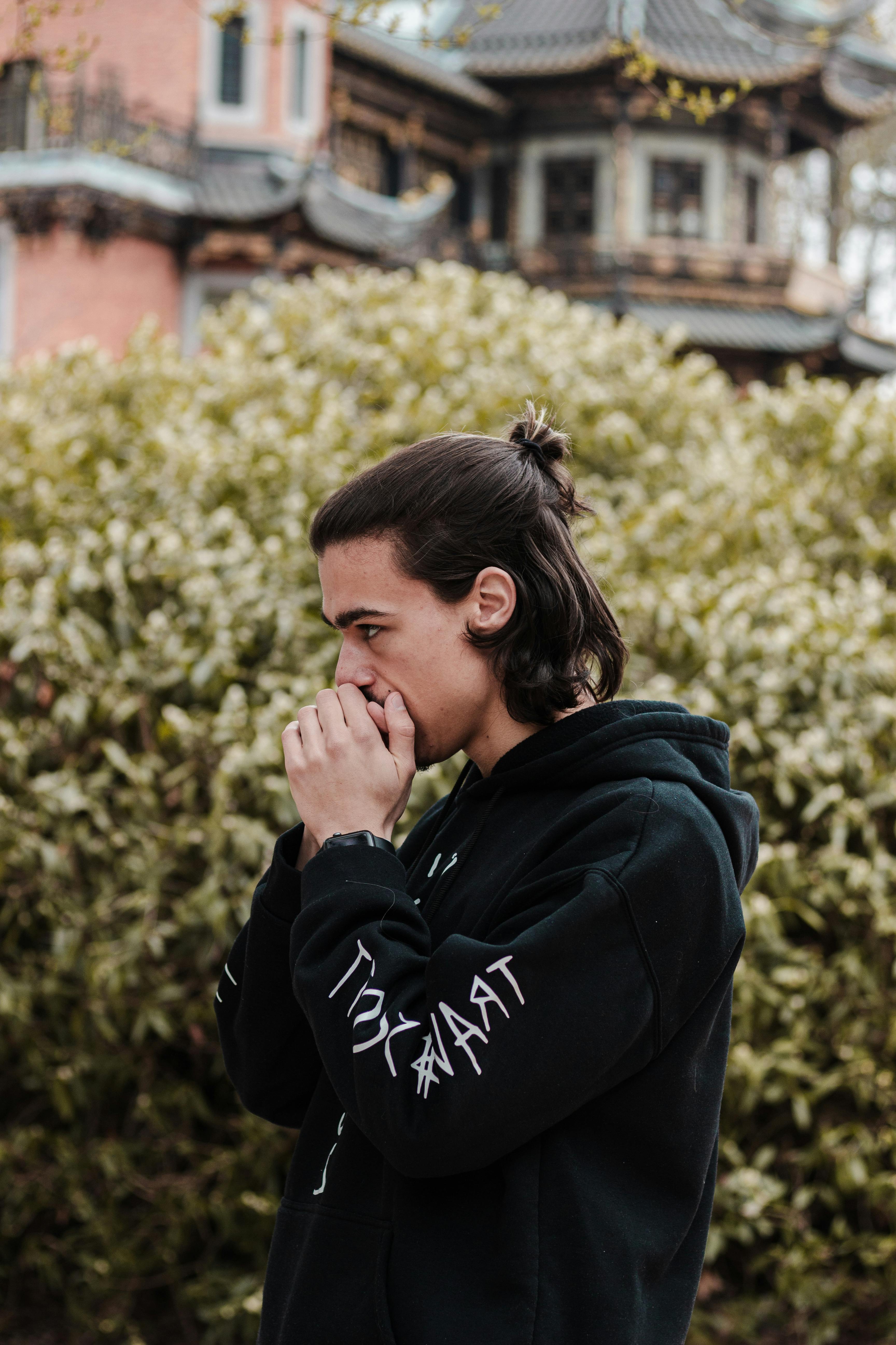 Side View of a Man in Black Hoodie · Free Stock Photo