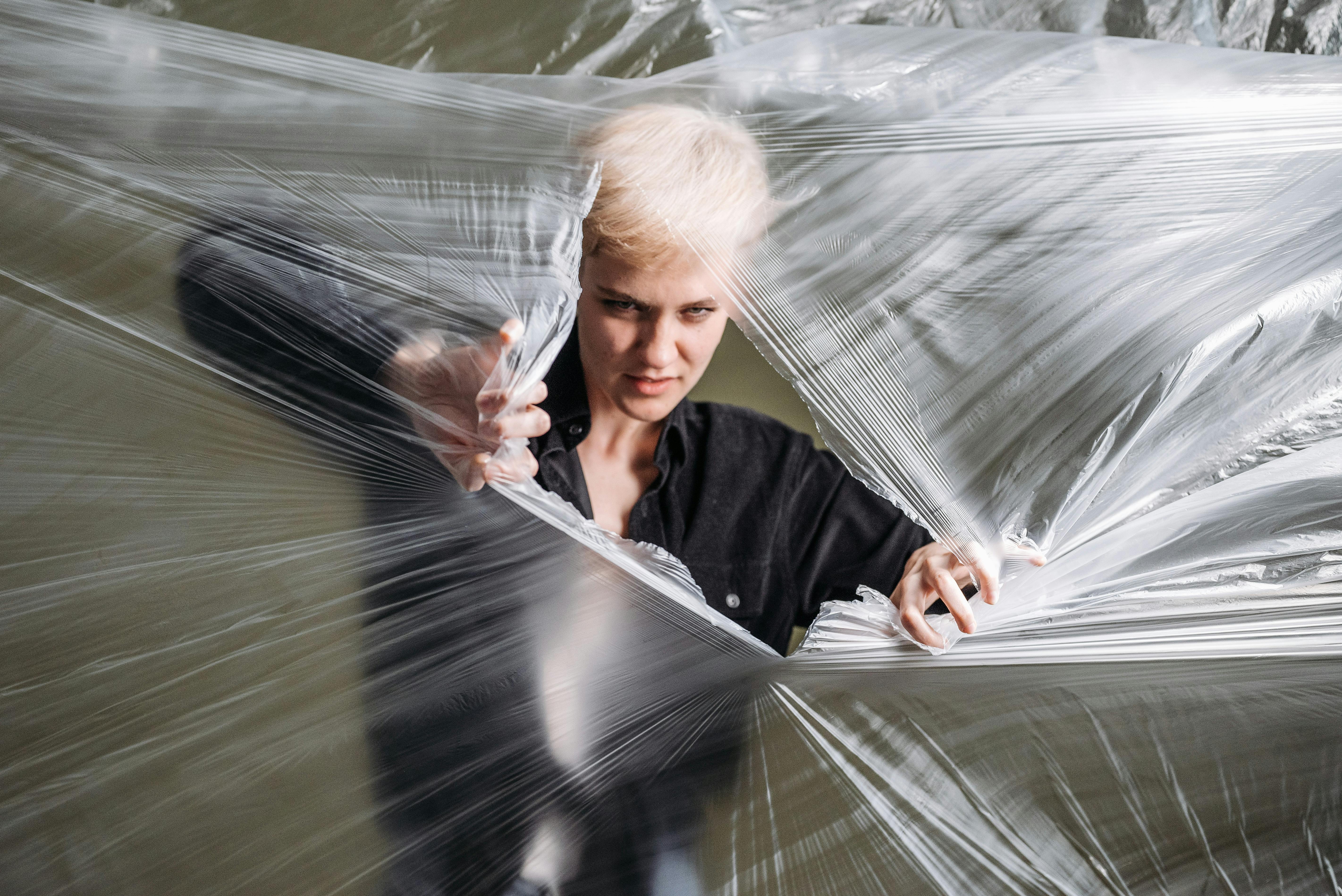 A Woman Ripping Plastic · Free Stock Photo