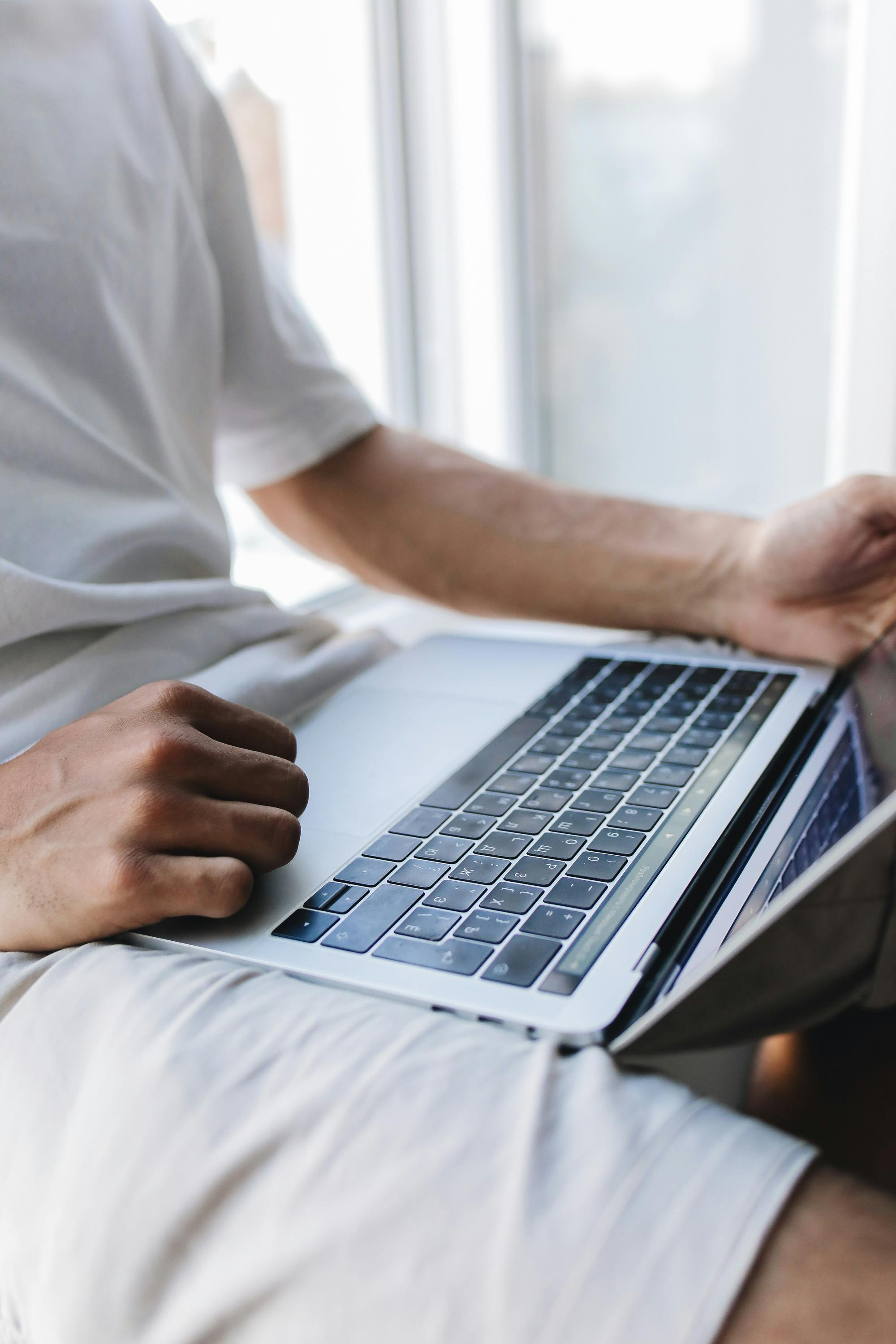 A Person Holding a laptop · Free Stock Photo