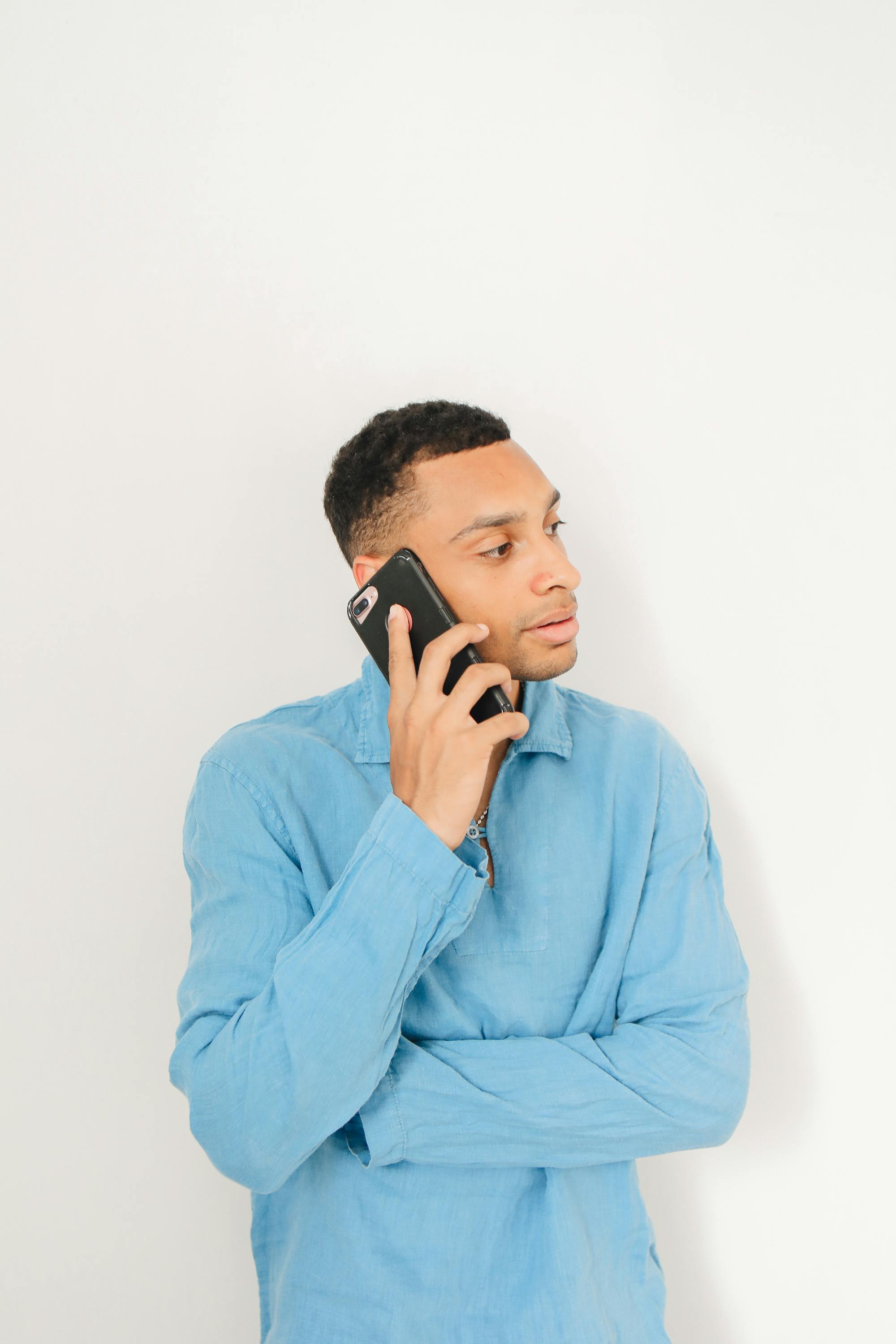 Close-Up Shot of a Man Having a Phone Call · Free Stock Photo