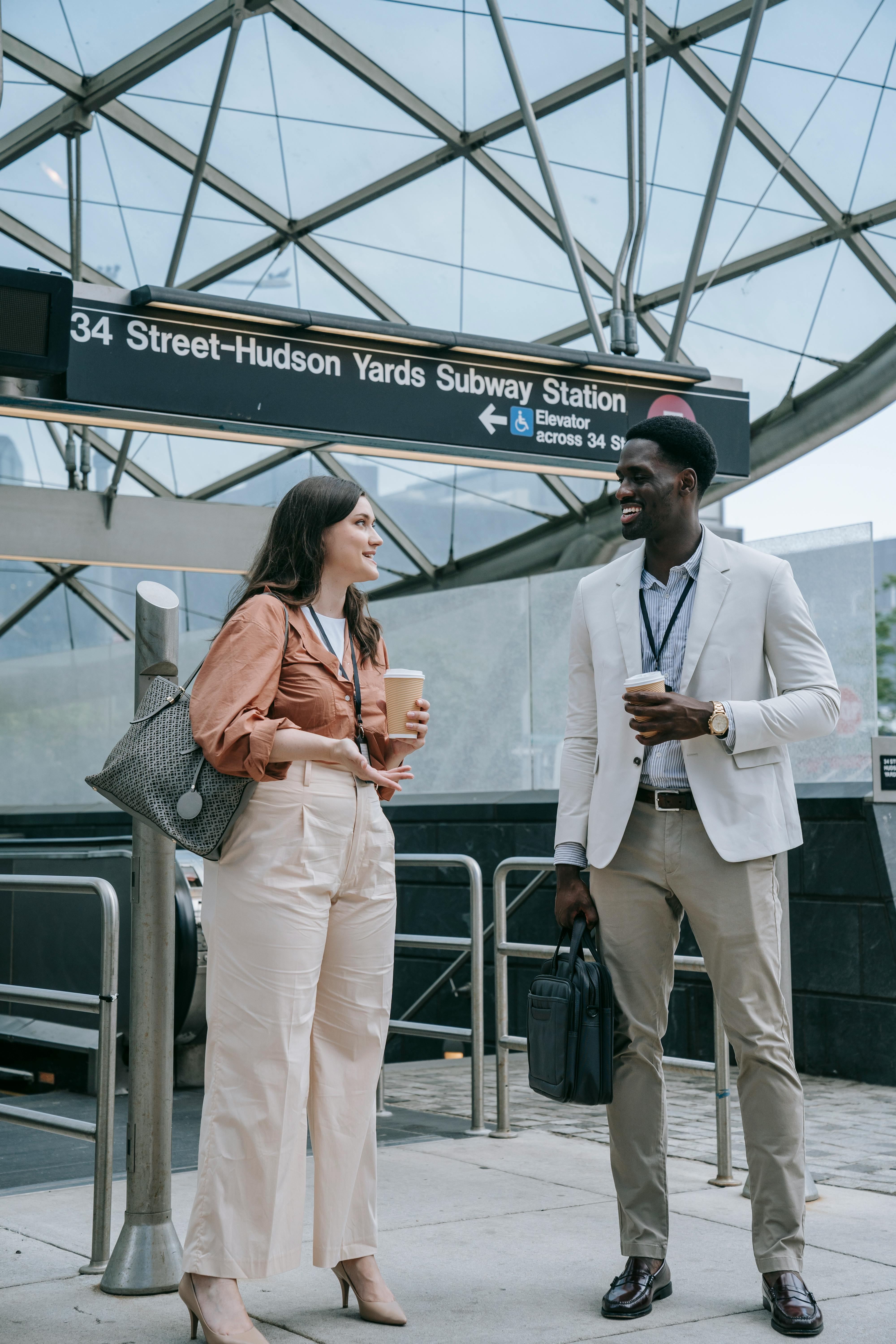 Man and Woman Talking at the Train Station · Free Stock Photo