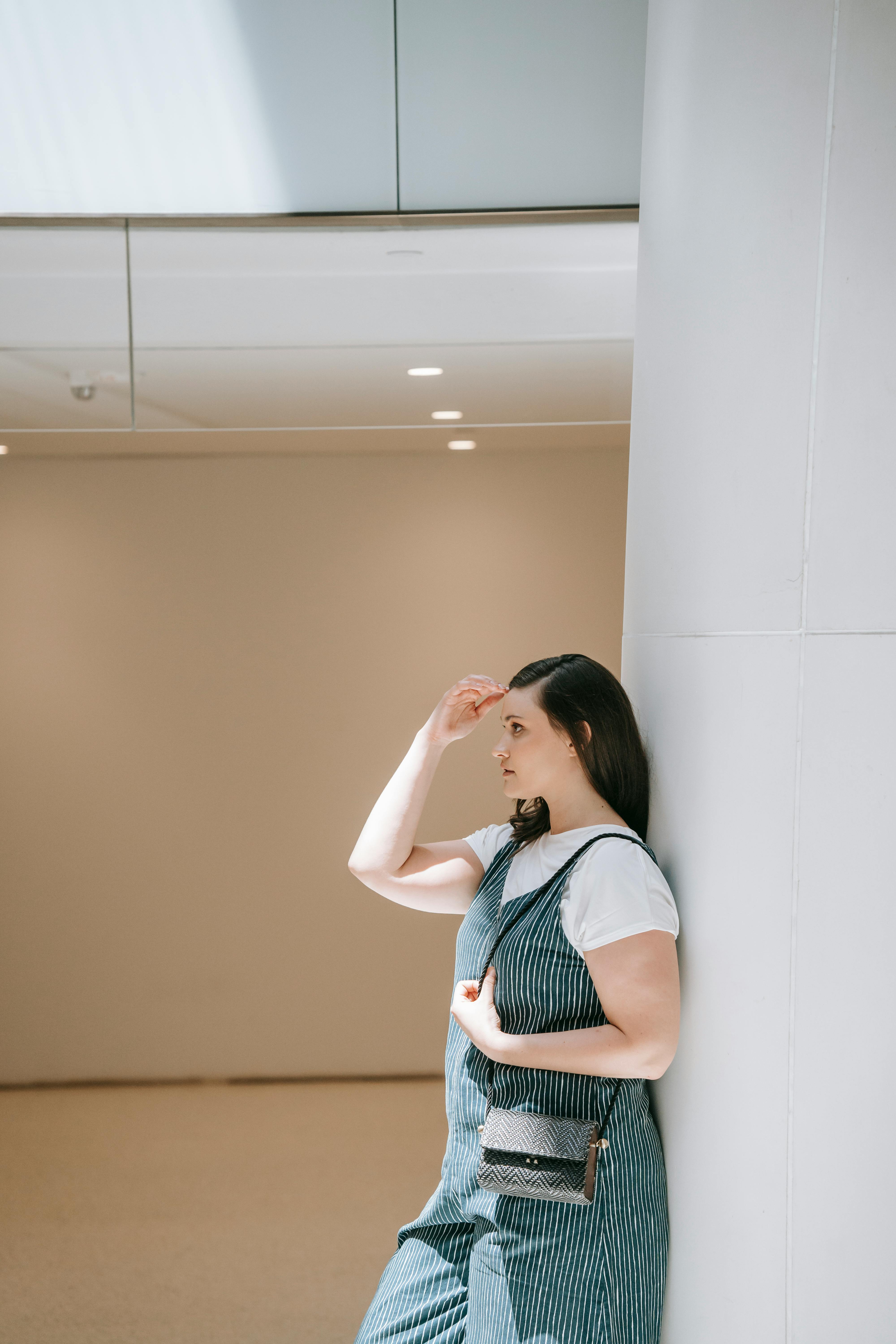Woman Standing by Wall · Free Stock Photo