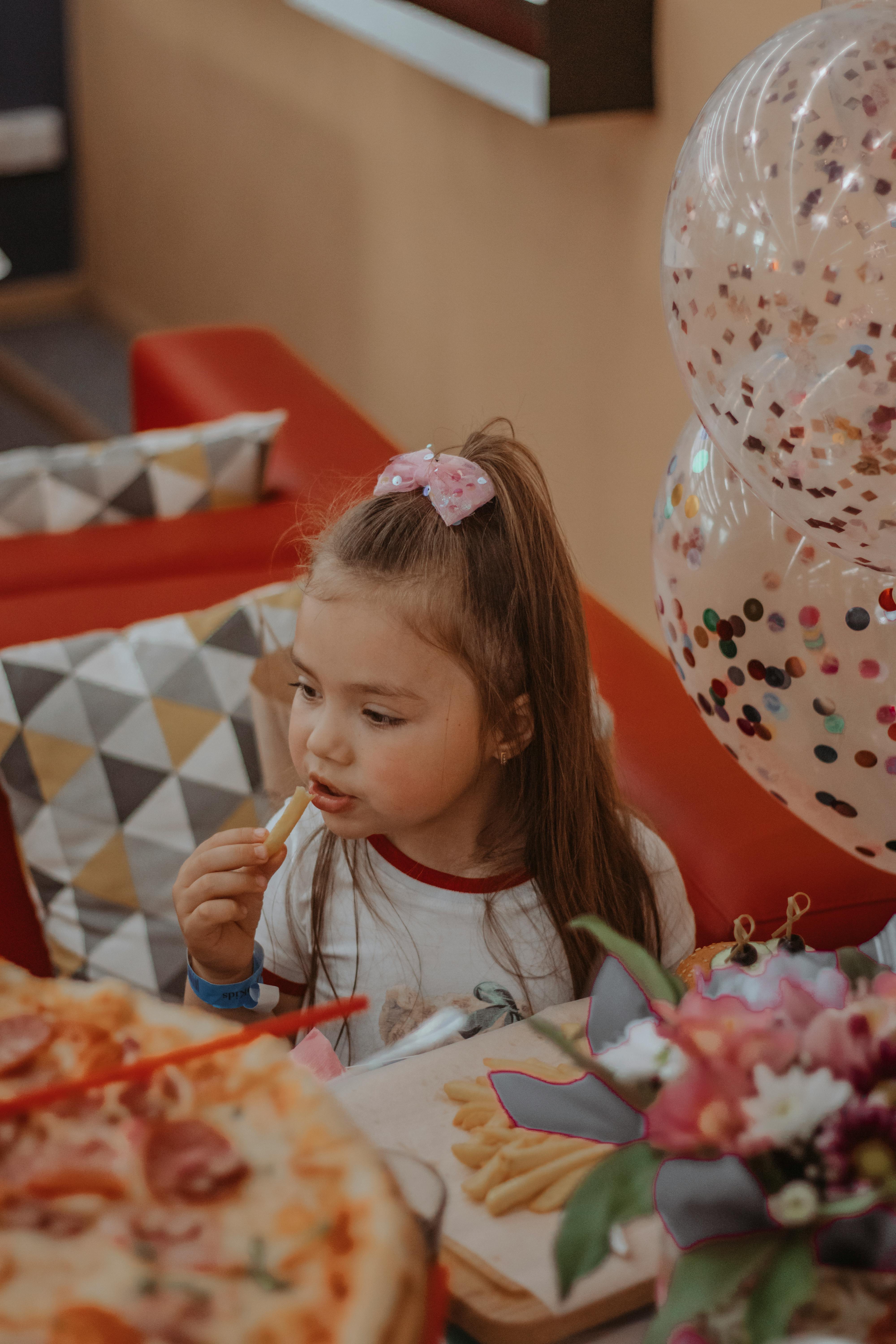 A Cute Girl with Ribbon on Her Hair · Free Stock Photo
