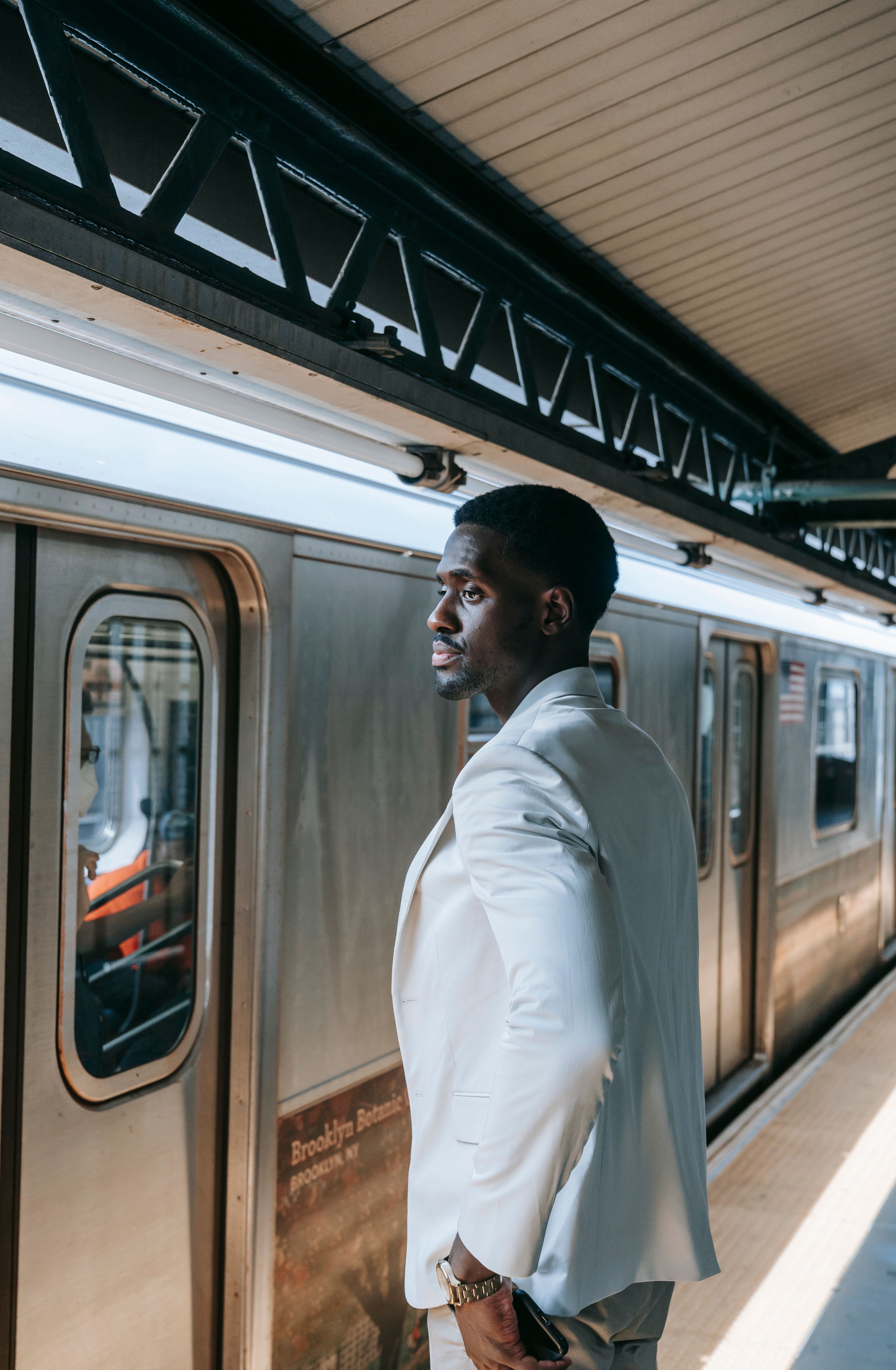 Man Standing Beside a Train · Free Stock Photo