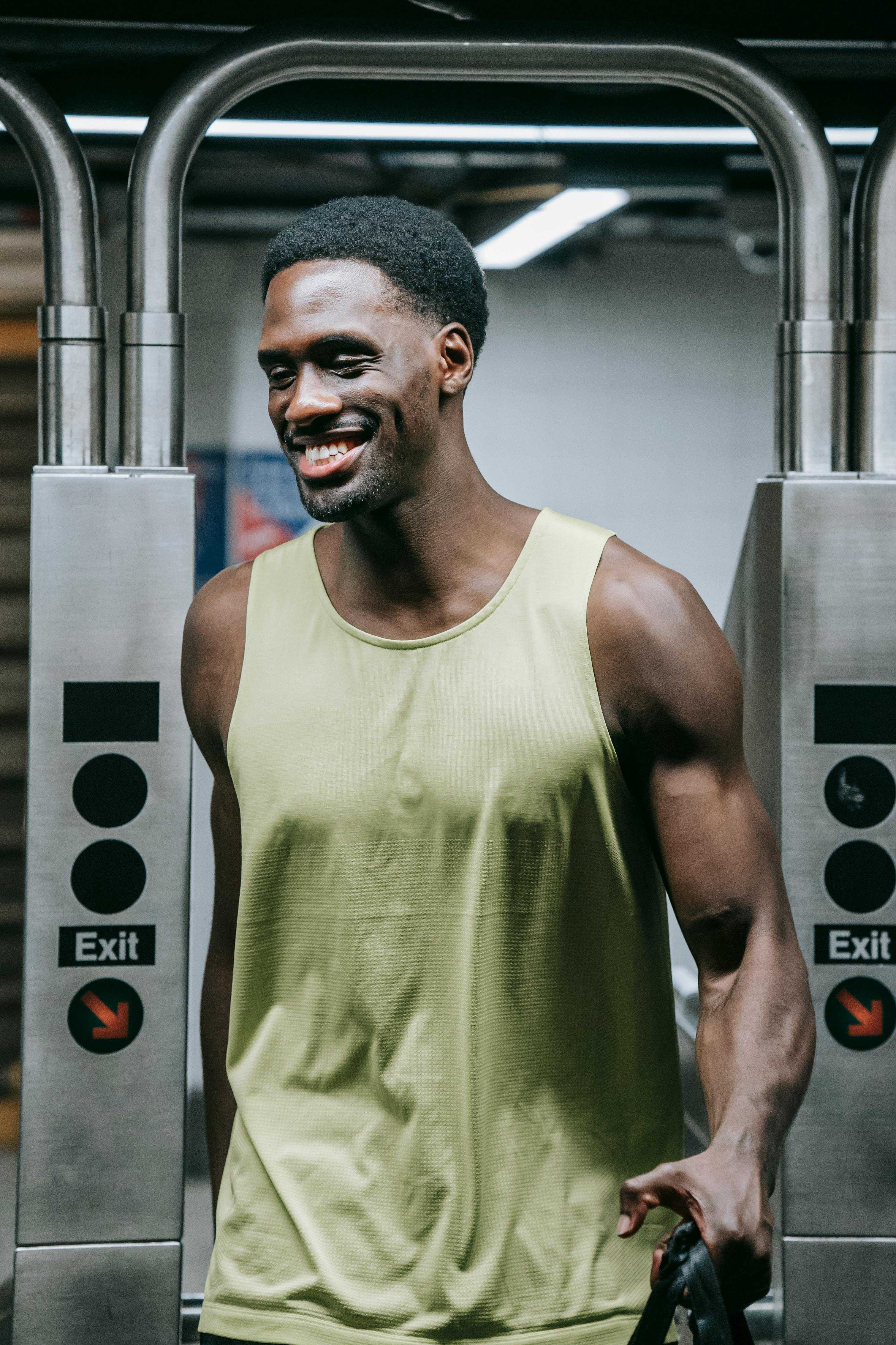 Man in Tank Top While Smiling · Free Stock Photo