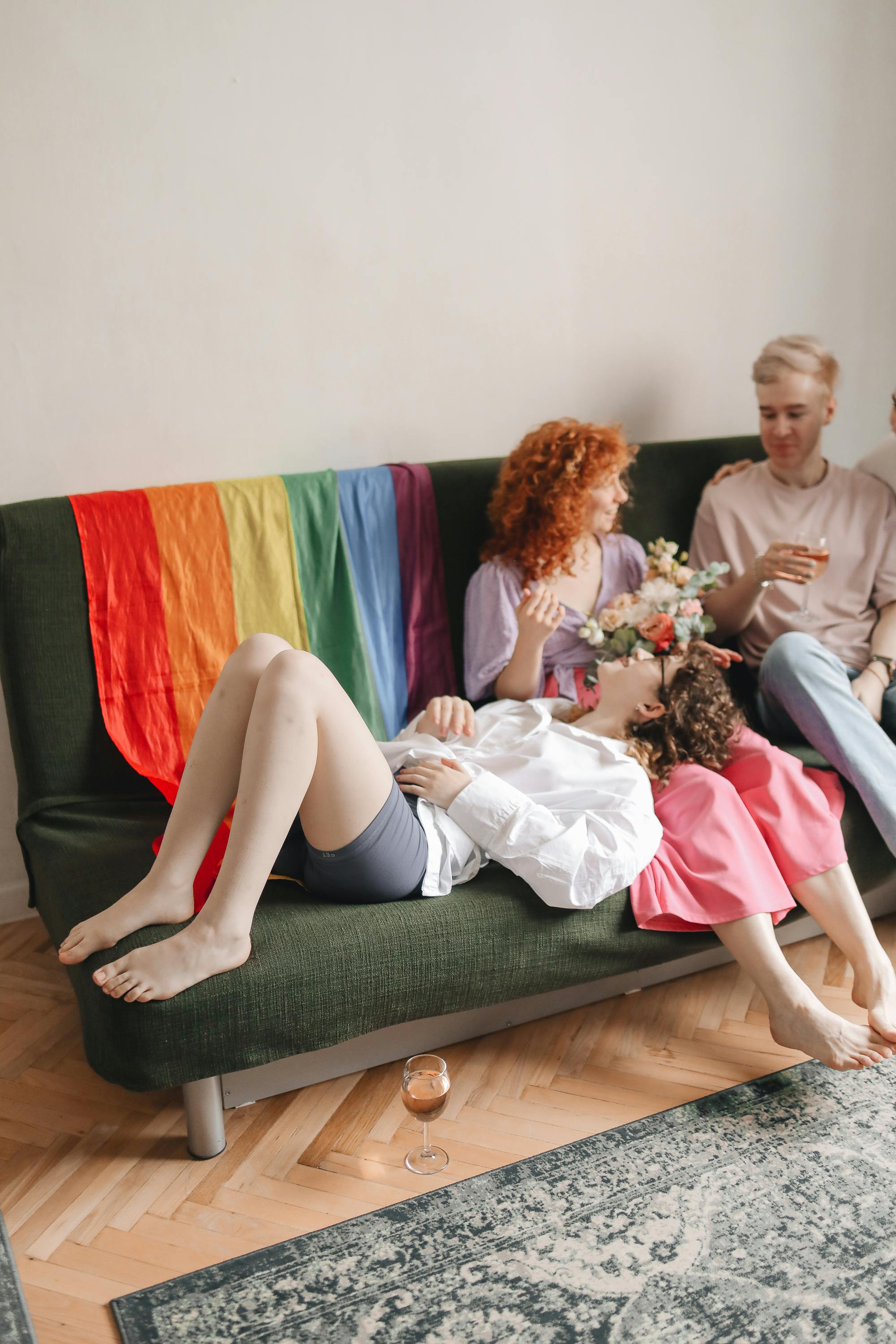 A People Sitting and Lying on a Sofa · Free Stock Photo