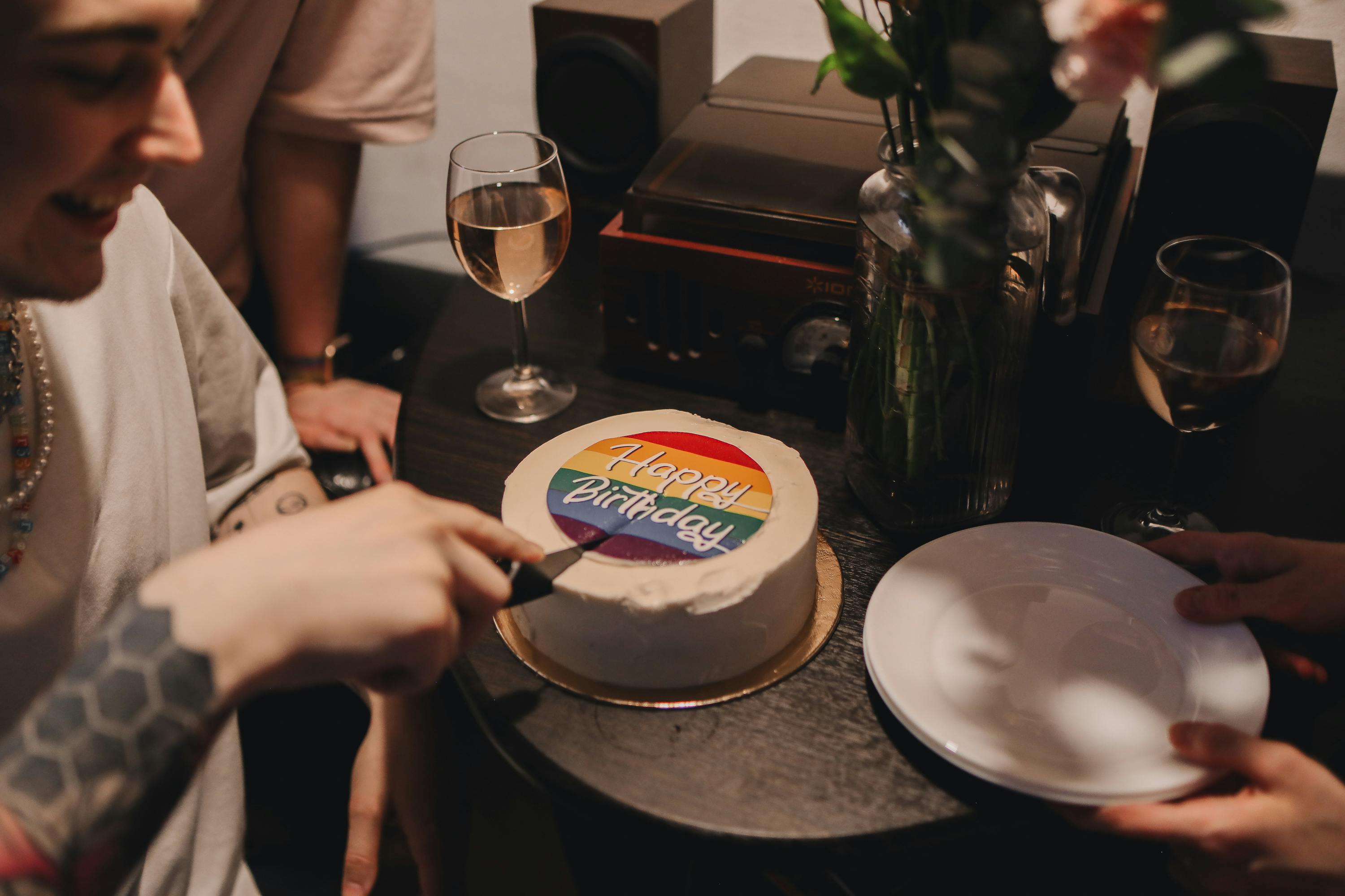 A Person Slicing a Cake · Free Stock Photo