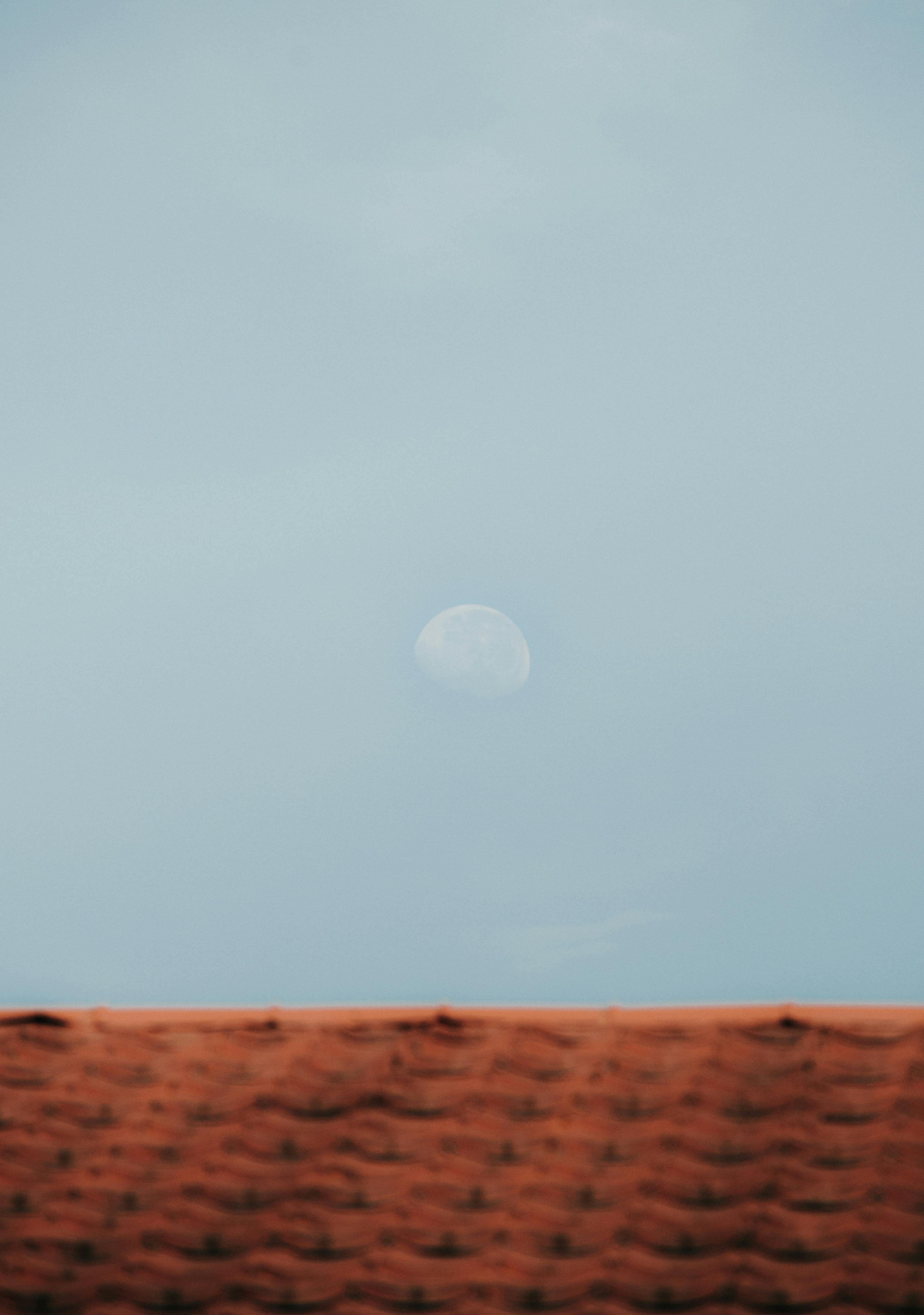 Moon on Sky over Roof · Free Stock Photo