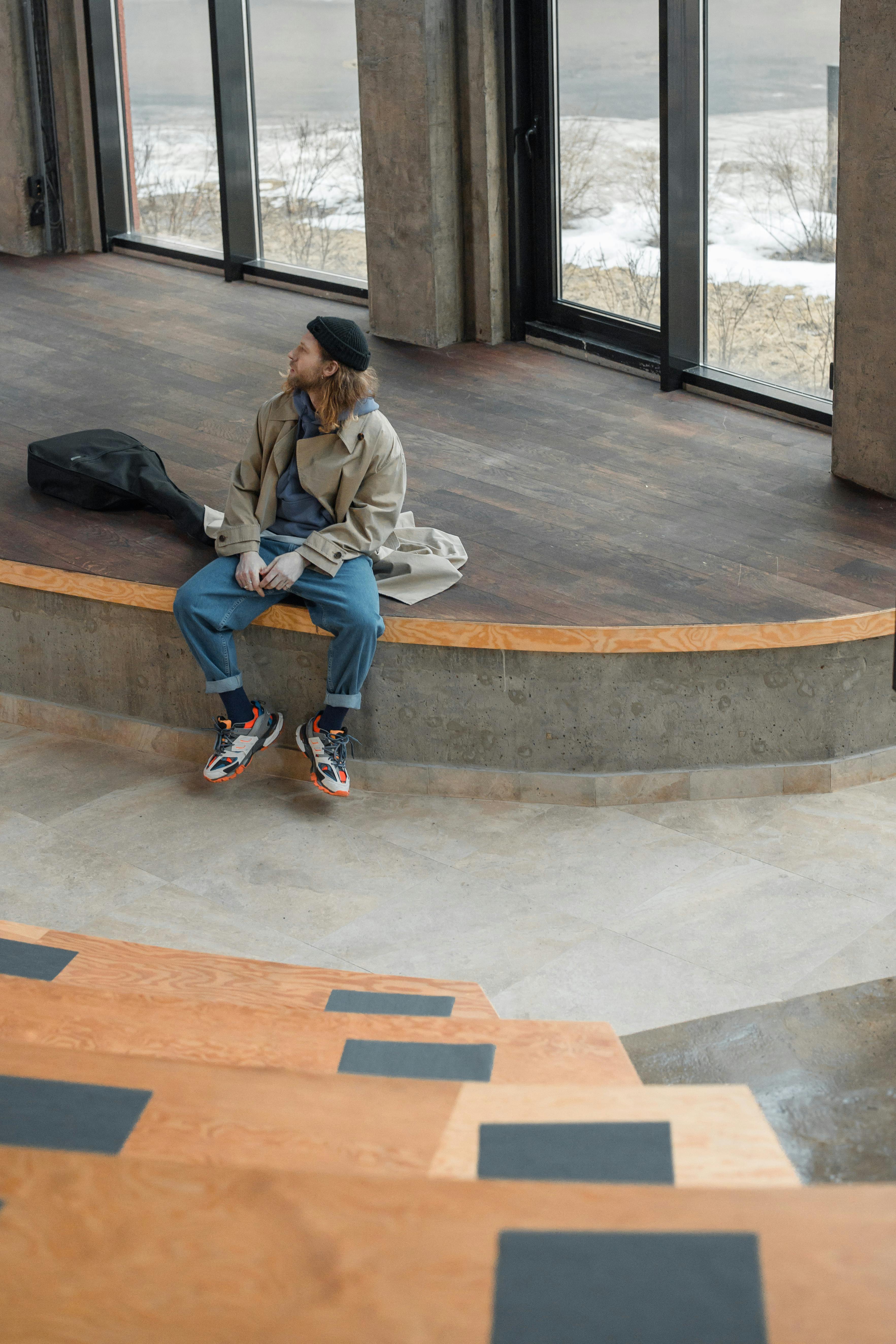 Man Sitting on a Platform · Free Stock Photo